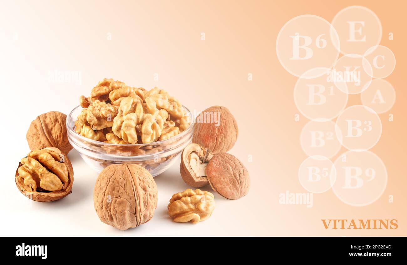 fresh kernels, broken and whole walnuts close-up isolated on color ...