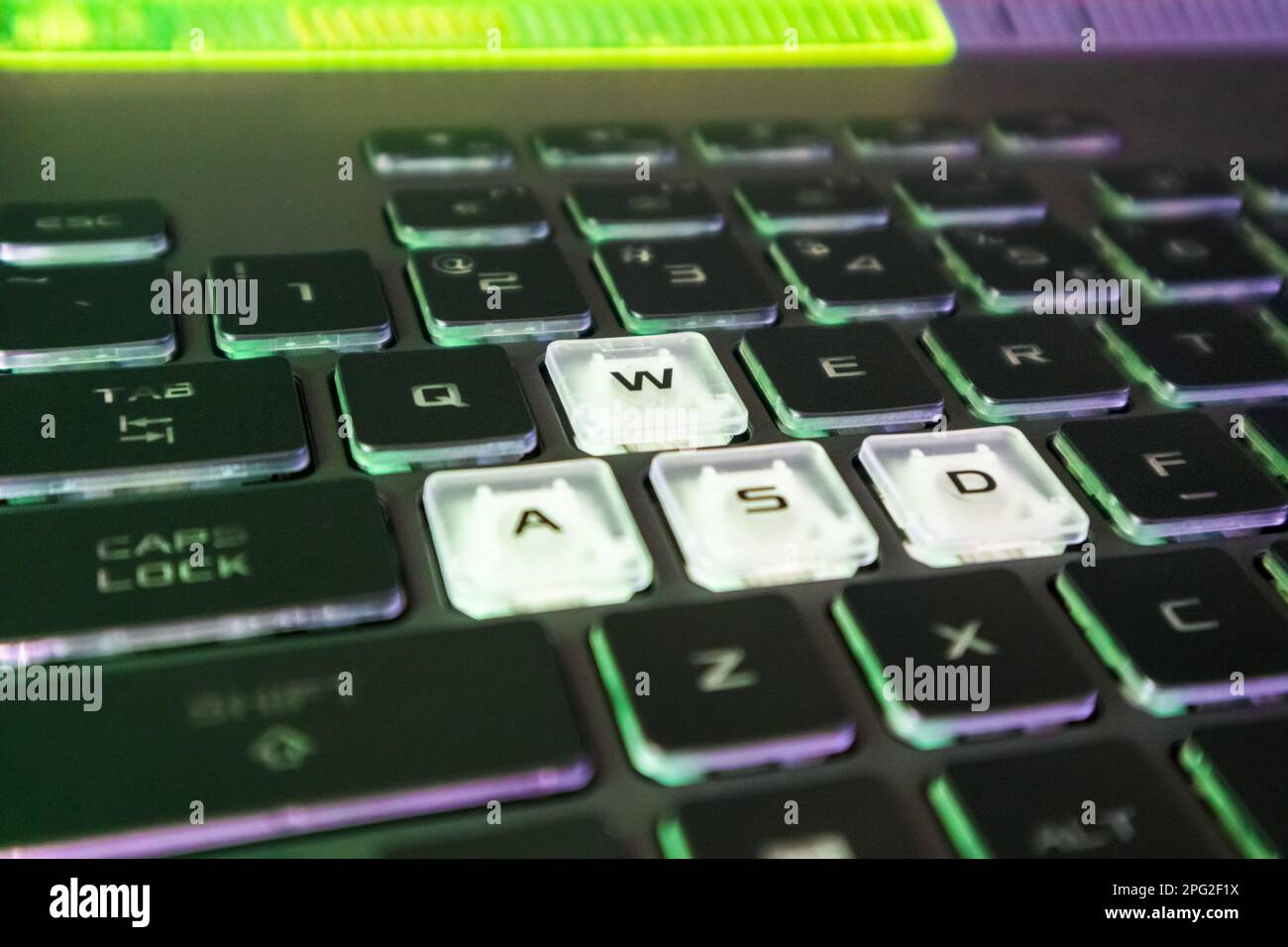 Highlighted gaming keys with green and purple light. Powerful dark ...