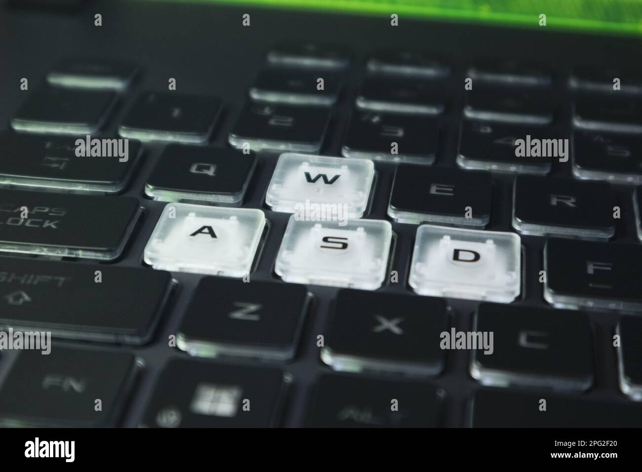 Highlighted gaming keys with blurred background. Powerful dark notebook ...