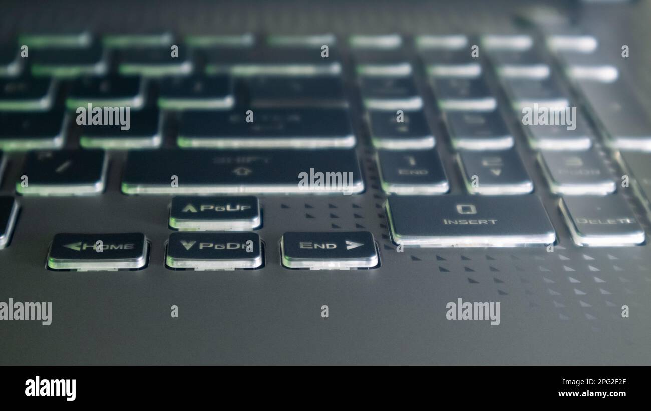 Laptop arrow keys with illumination and blurred background. Gaming ...