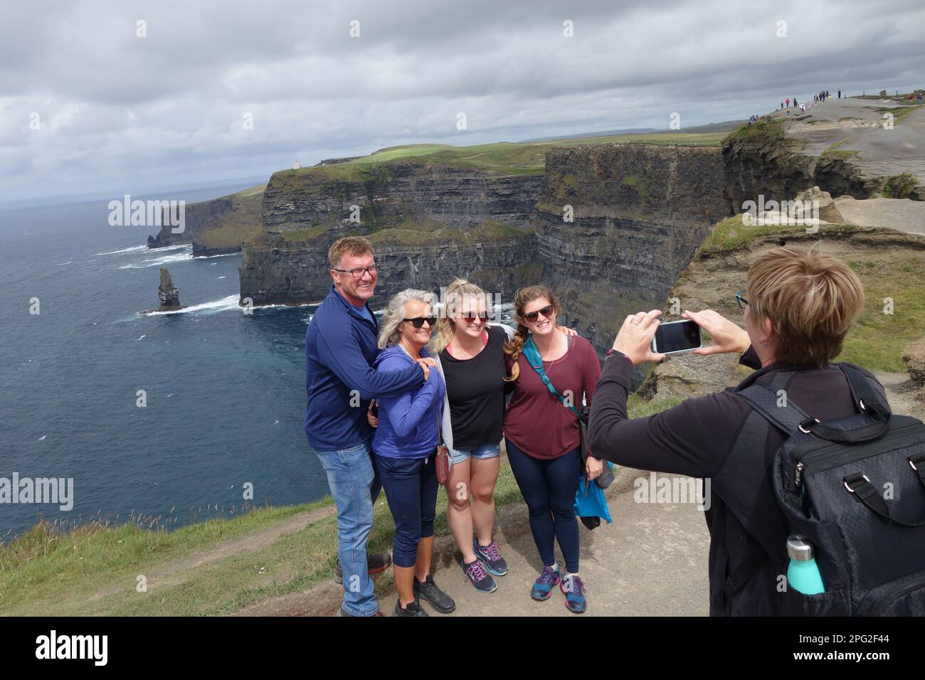 tourists visiting Cliffs of Moher, Ireland Stock Photo - Alamy