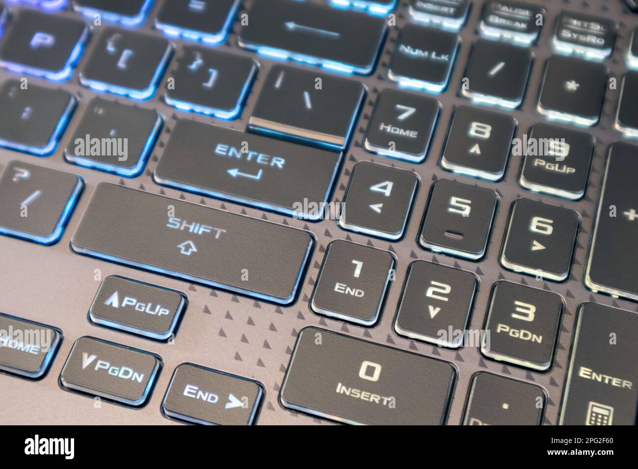 Laptop keys with illumination and blurred background. Gaming powerful ...