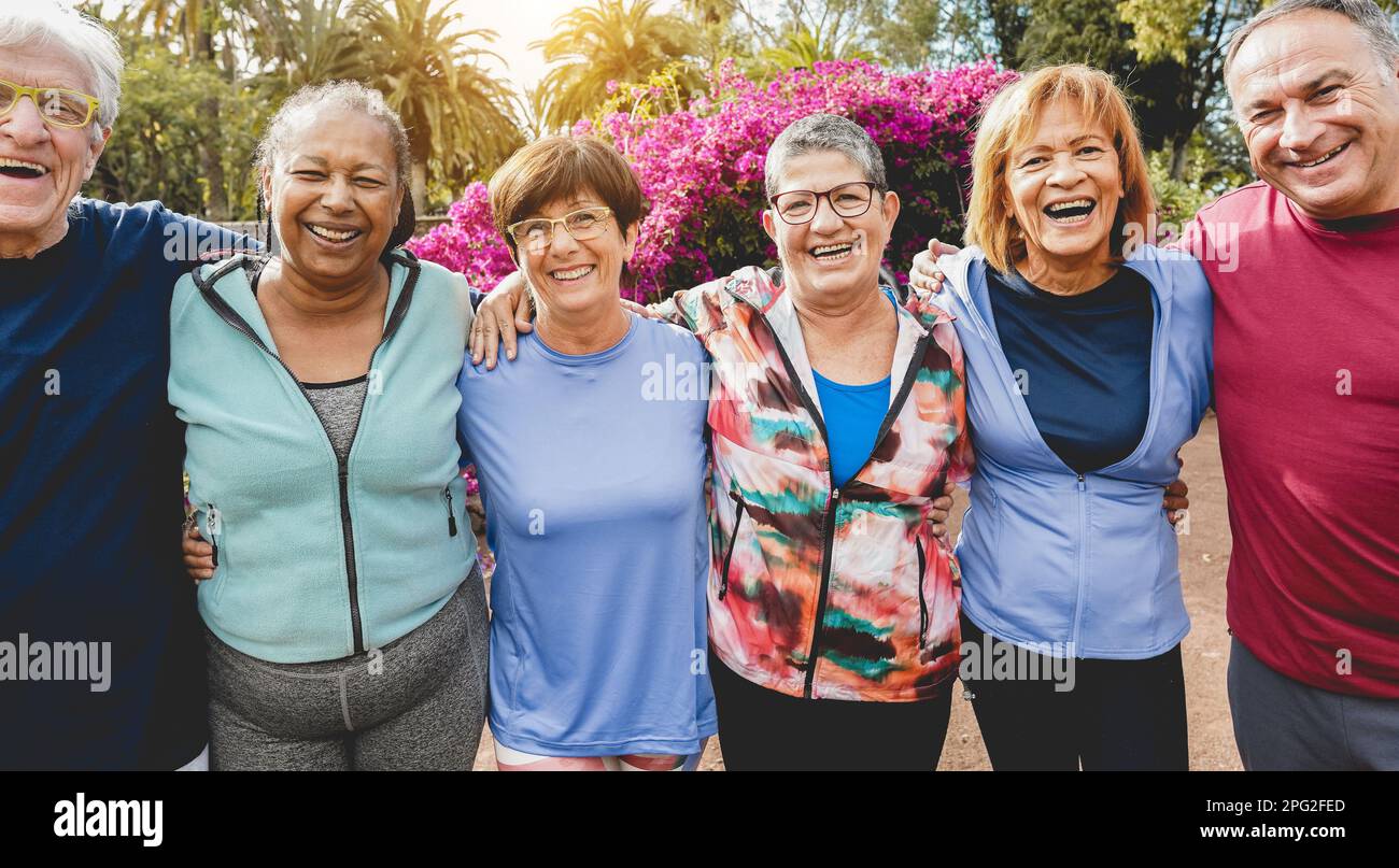 Multiracial senior people having fun after workout exercises outdoor ...