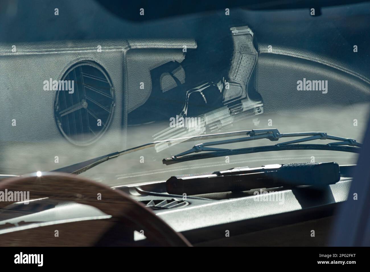 Toy Gun on Dashboard Cars Stock Photo - Alamy