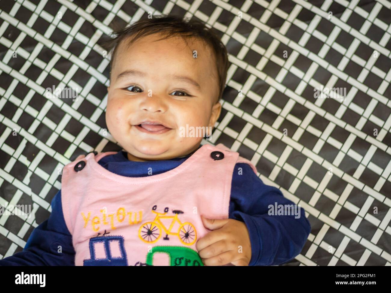 cute infant facial expressing from top angle indoor shot Stock Photo ...