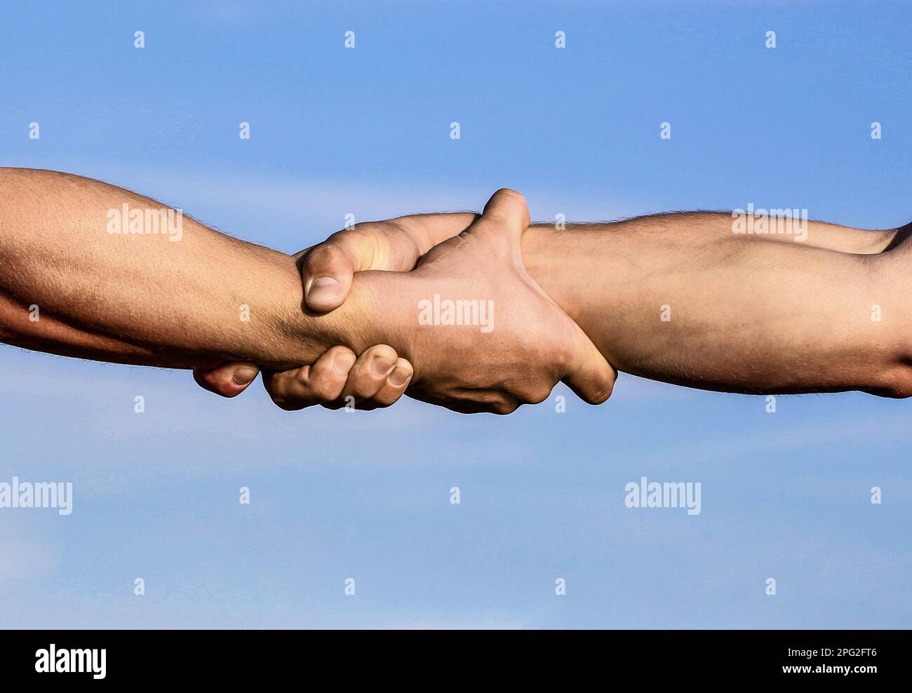 Helping hand concept and international day of peace, support. Two hands ...