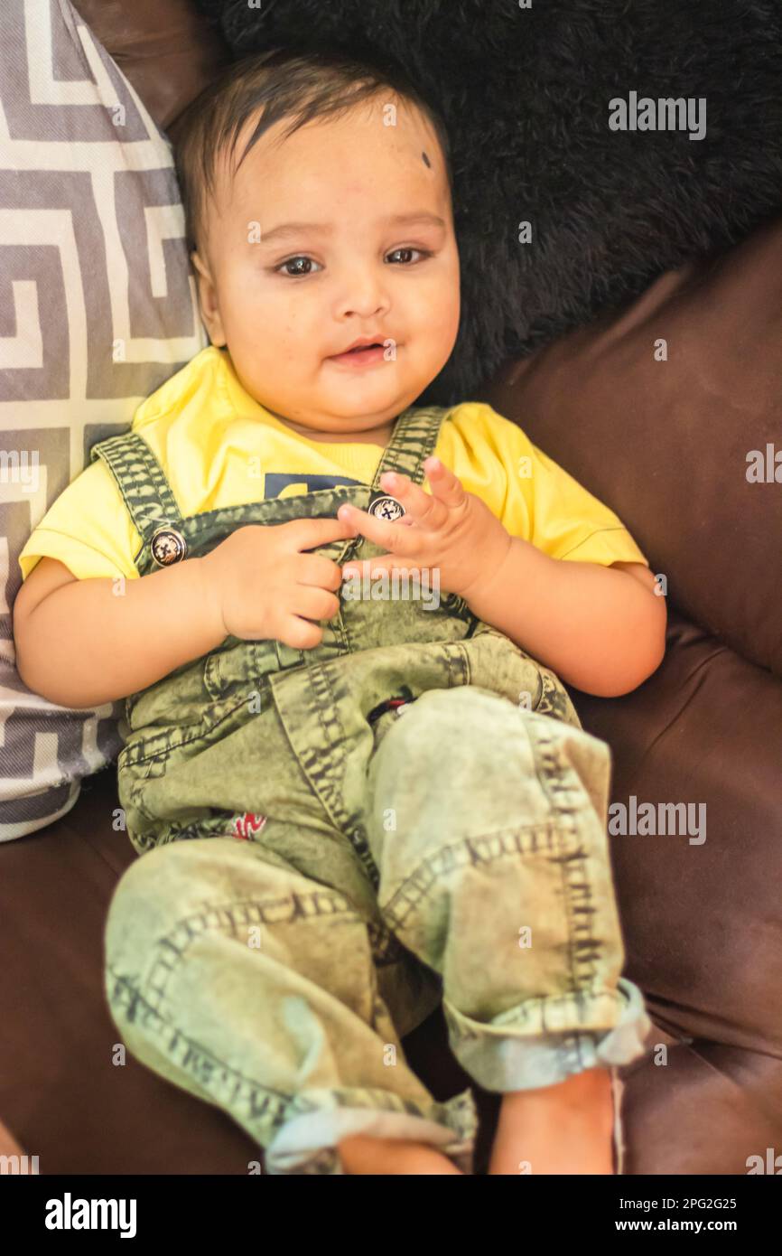 cute infant facial expressing from top angle indoor shot Stock Photo ...