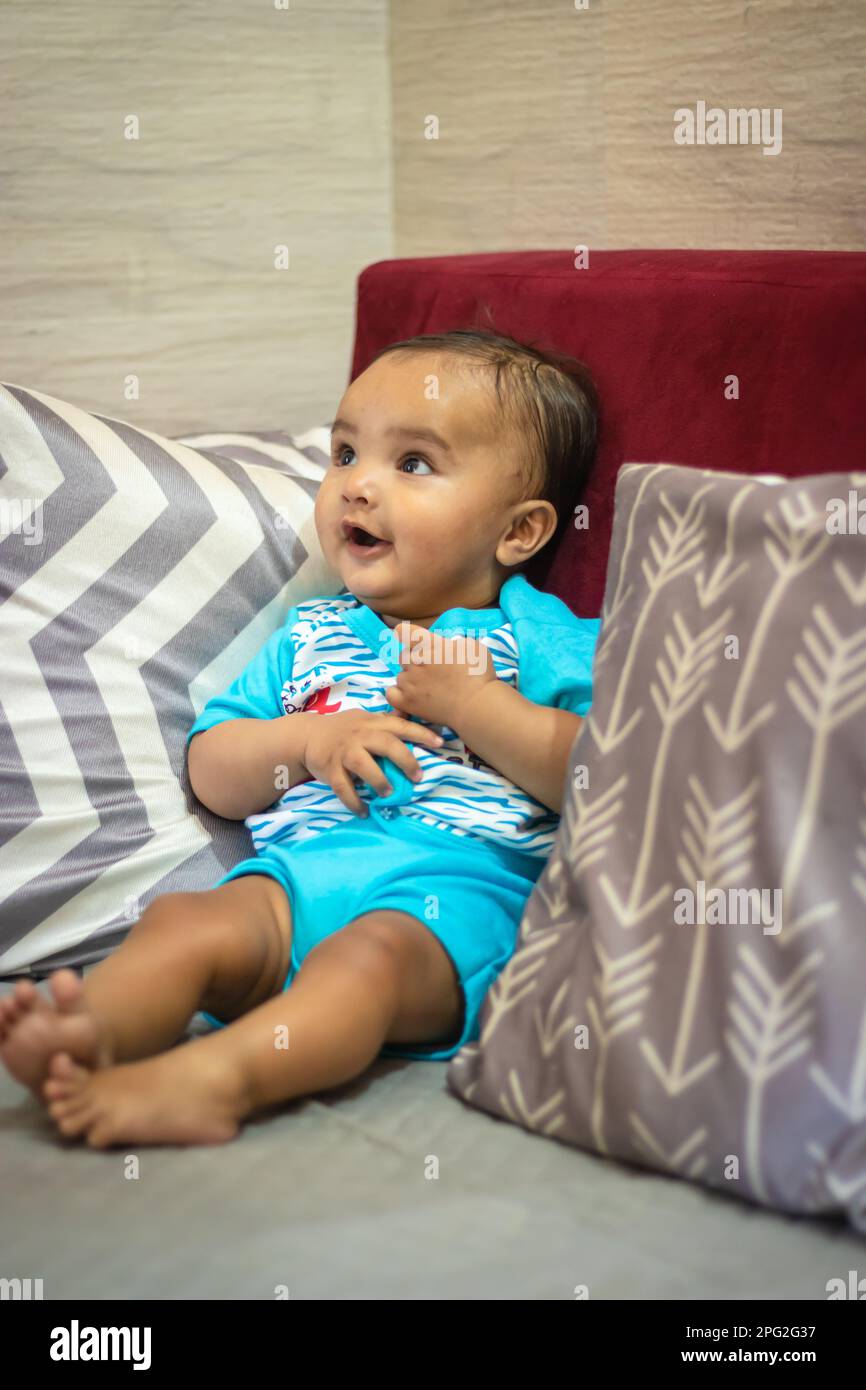 cute infant facial expressing from top angle indoor shot Stock Photo ...