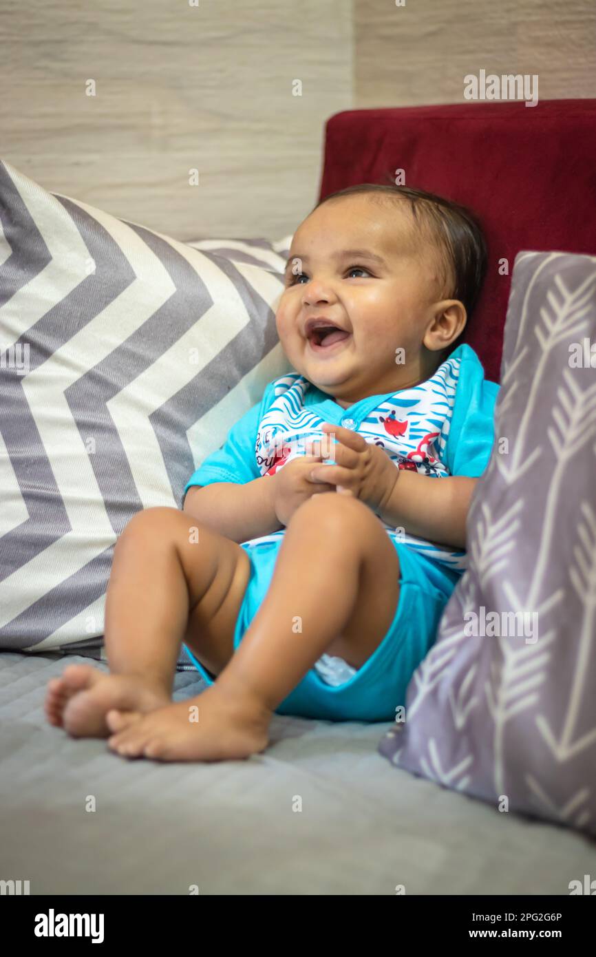 cute infant facial expressing from top angle indoor shot Stock Photo ...