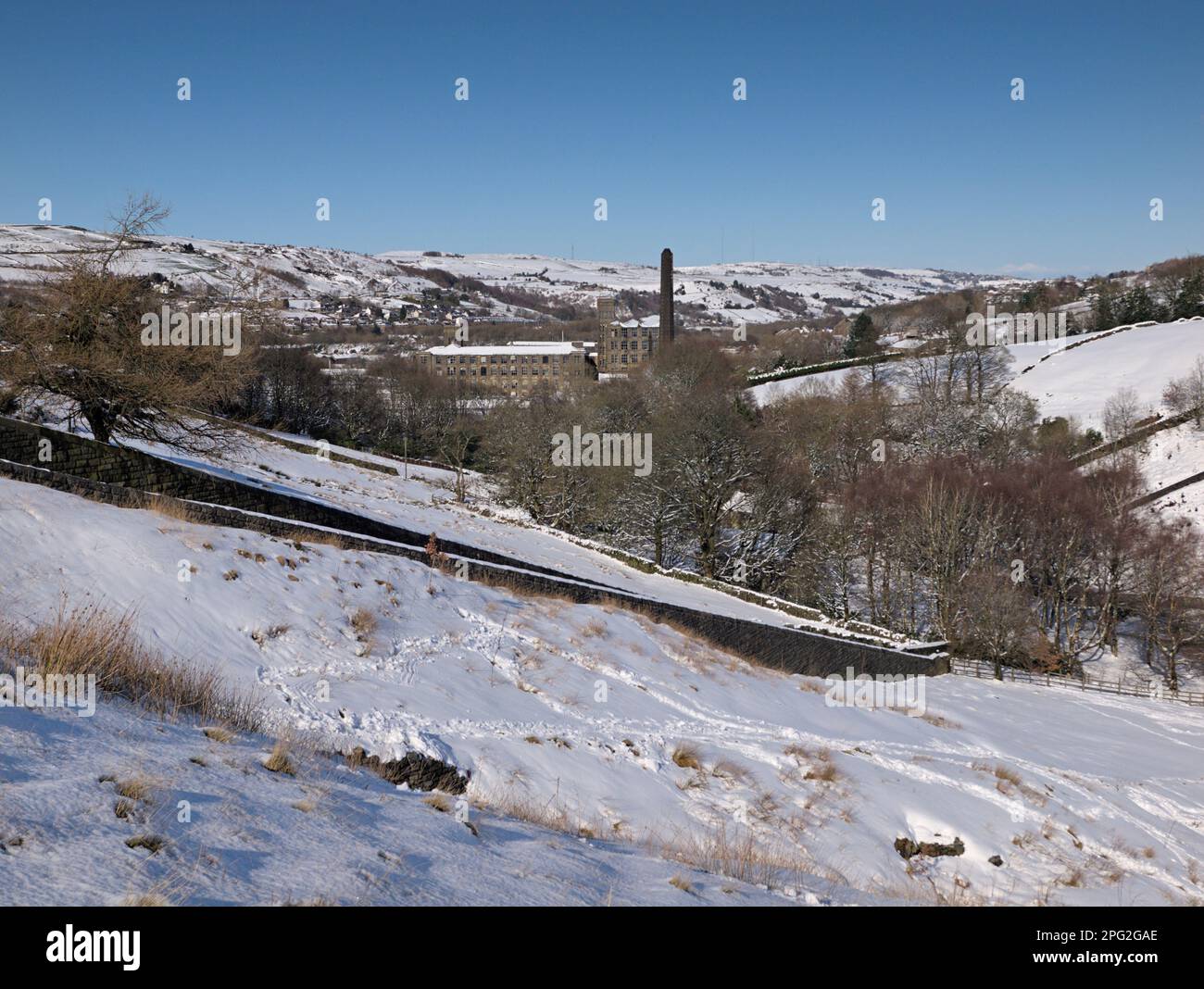 Bank Bottom Mills and the village of Marsden in snow Stock Photo - Alamy