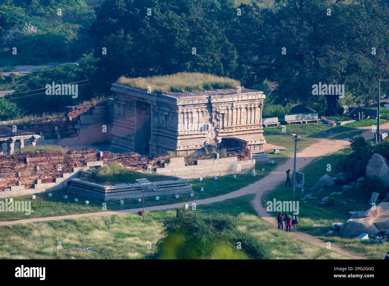Tourists wandering through the ruins at Hampi in Karnataka. Hampi, the ...