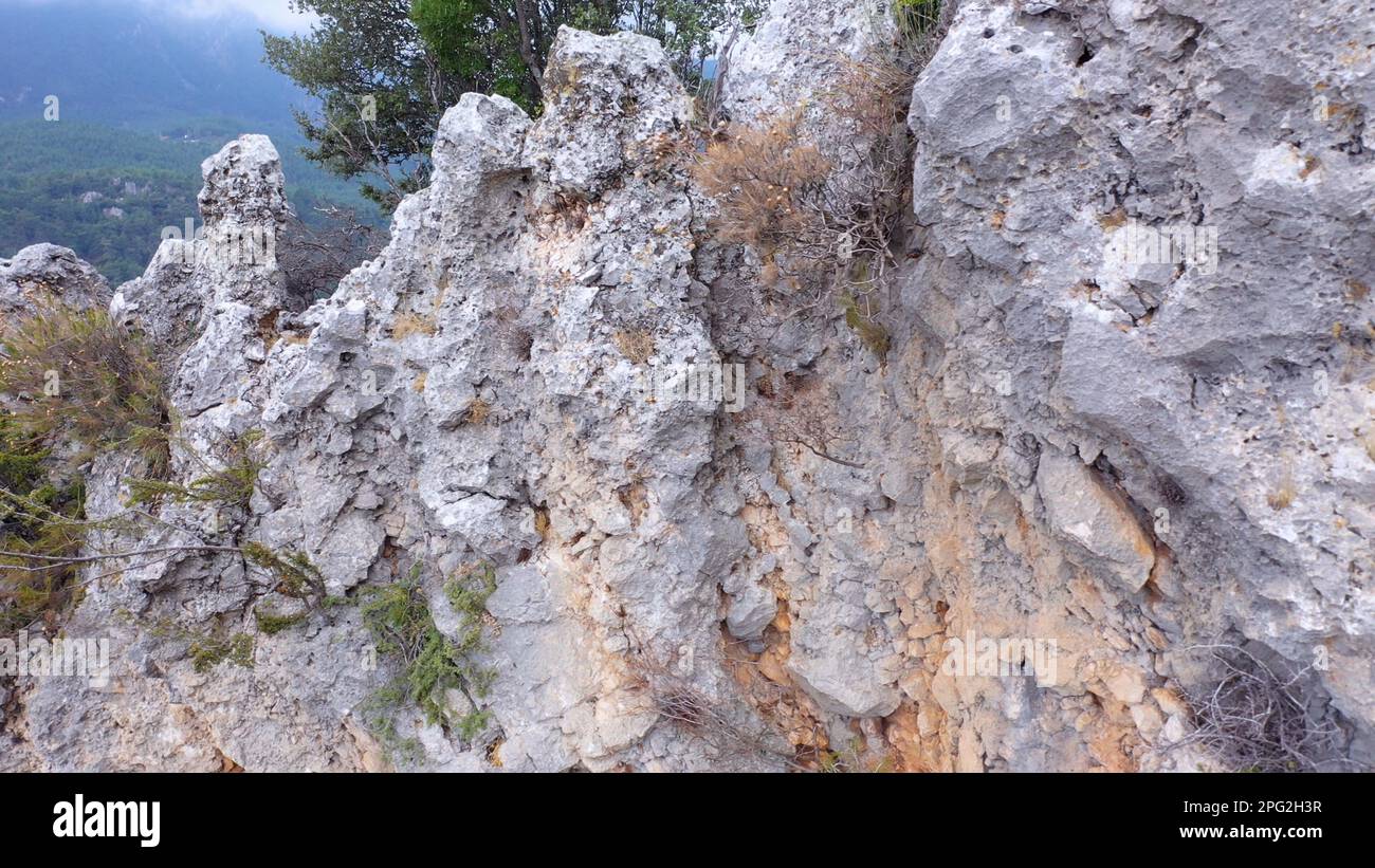 Stone rock texture of the mountain. Spectacular view of steep rocky cliff above mountain Stock ...
