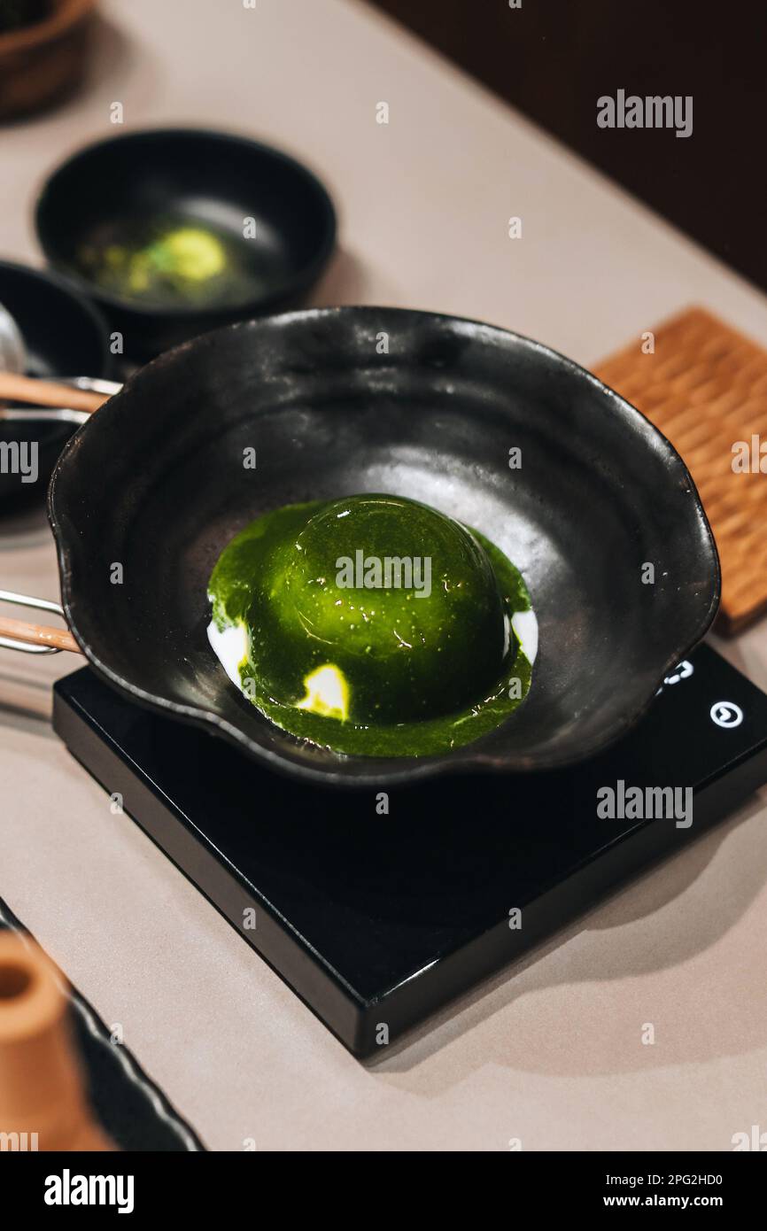 Preparing a dessert with Japanese matcha powder. Still life with ...
