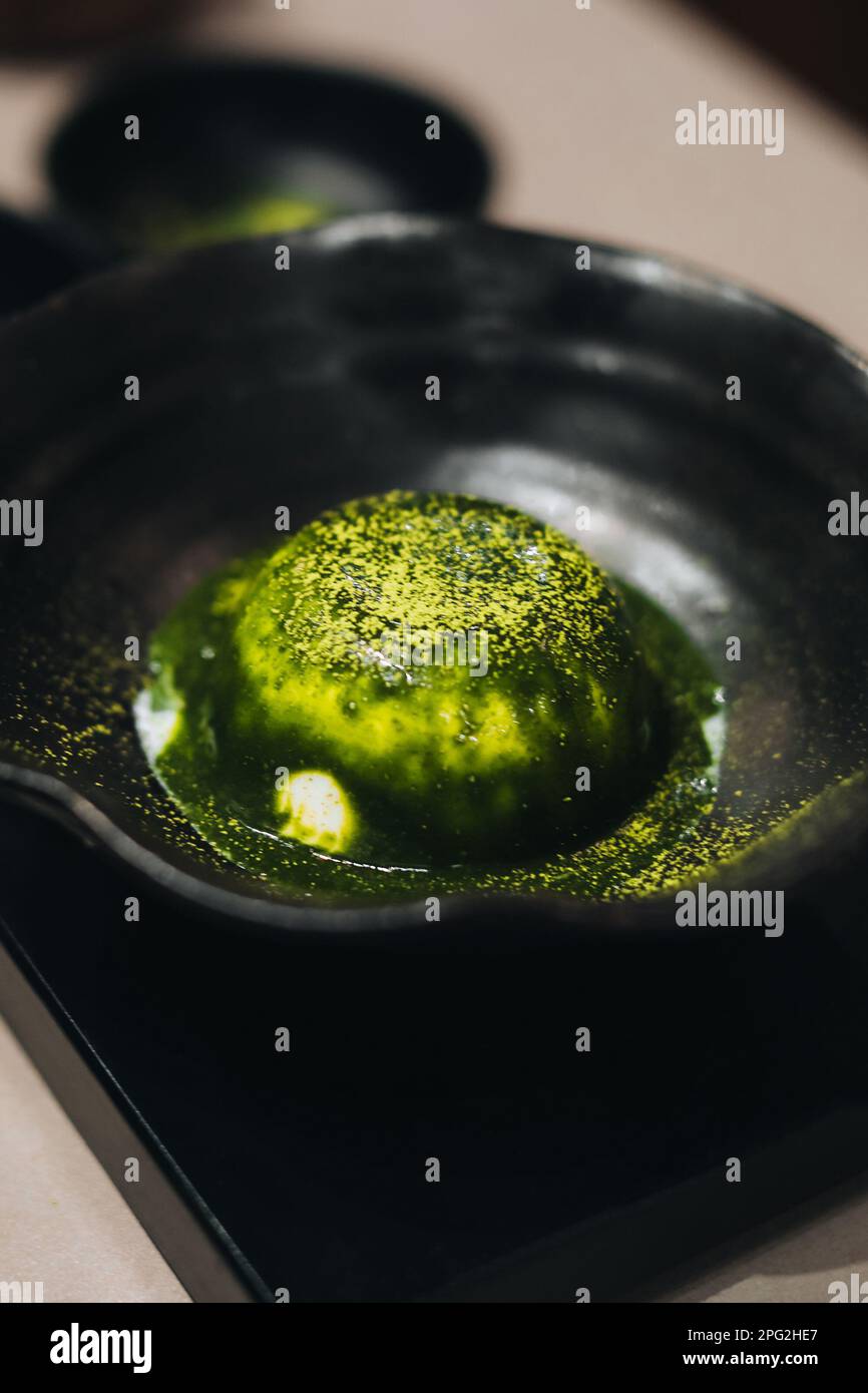Preparing a dessert with Japanese matcha powder Stock Photo - Alamy
