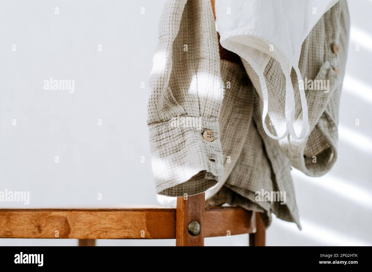 Close up white handmade linen top and natural waffle linen shirt on ...