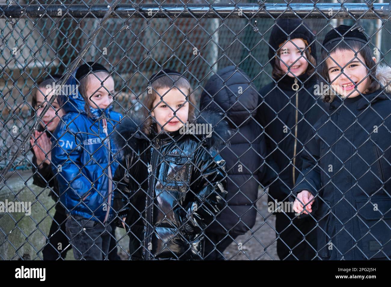 Five orthodox Jewish yeshiva boys with peyus smile for this photog ...