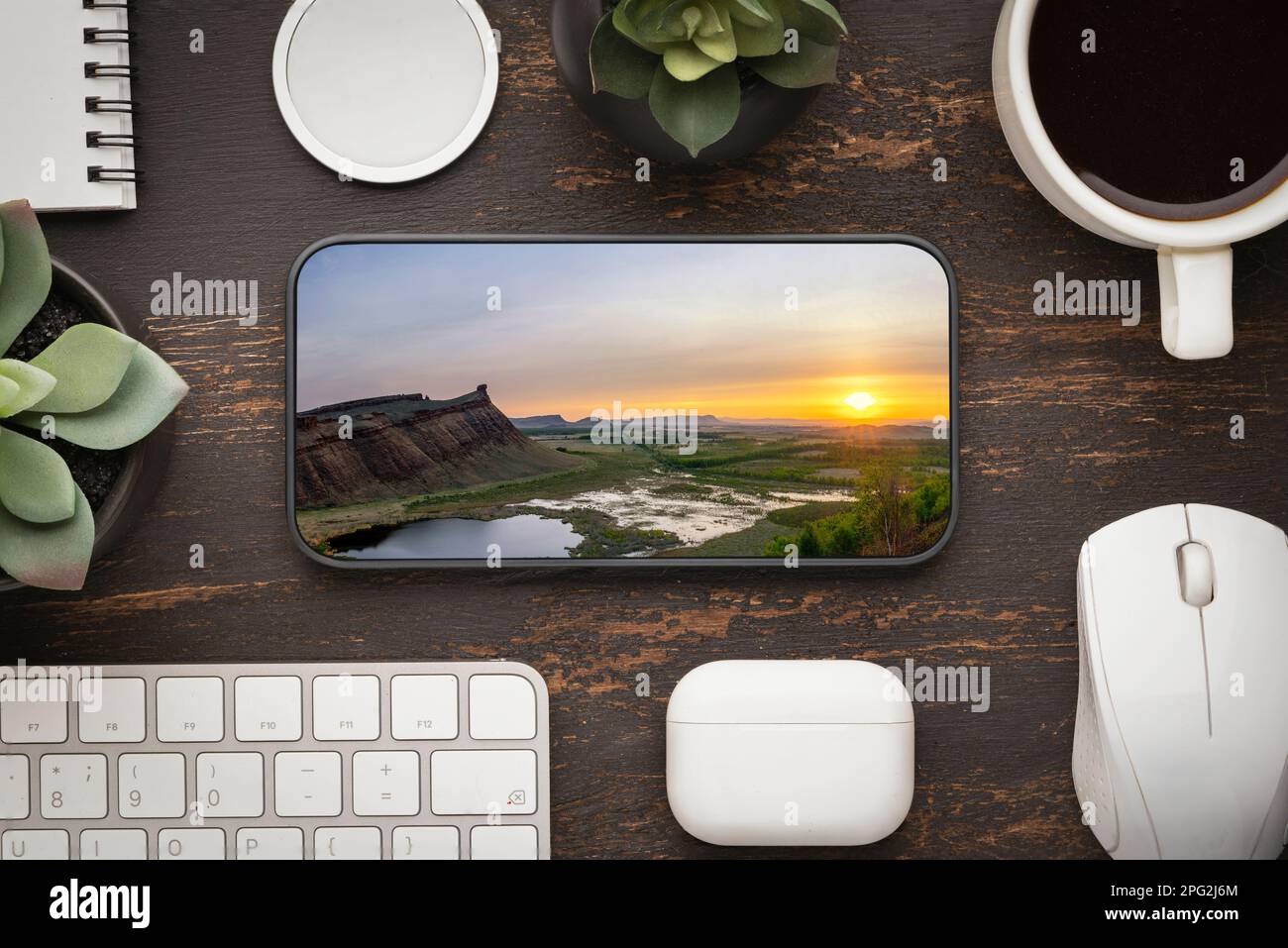 beautiful sunset mountain landscape on mobile phone screen. the dream ...