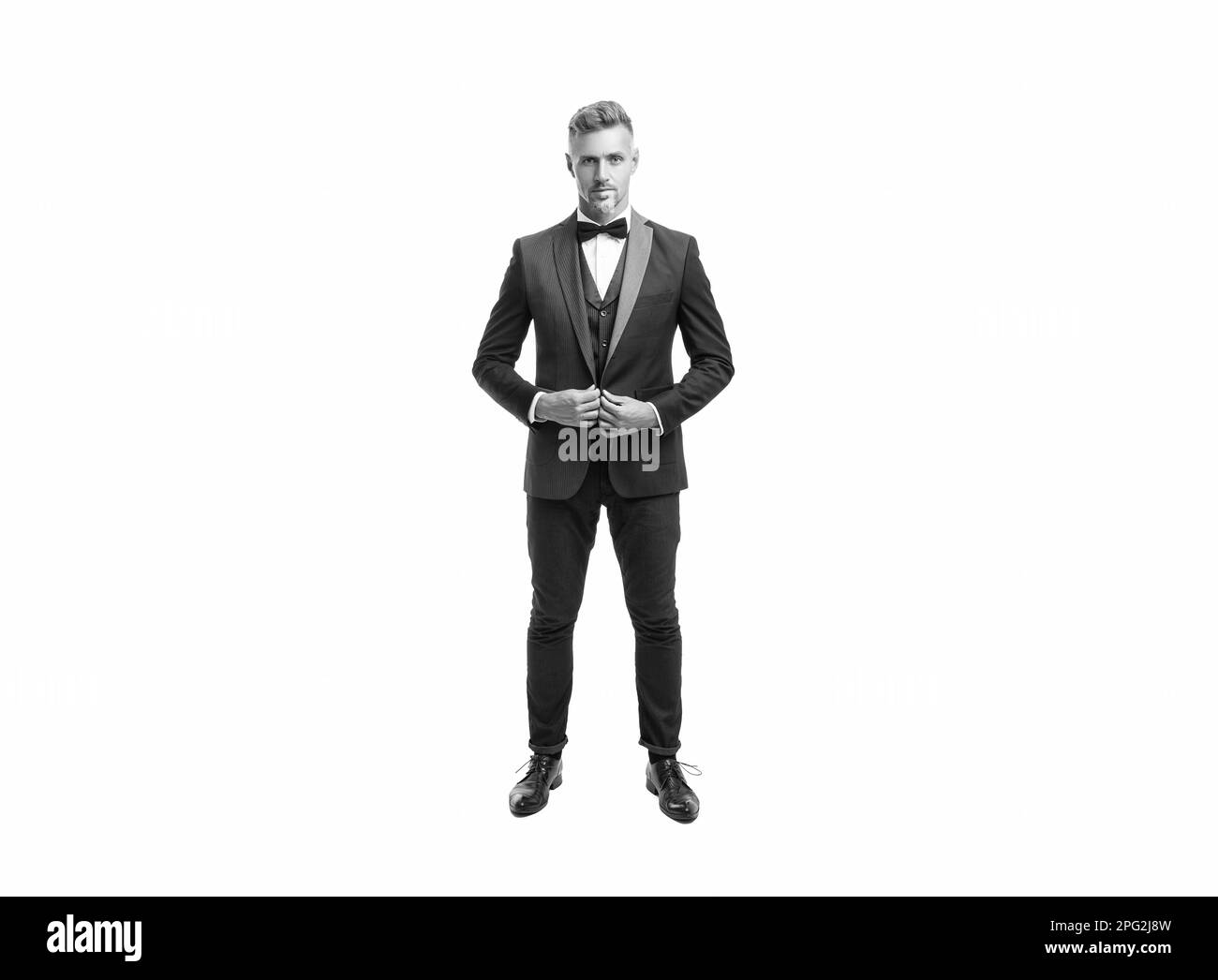 full length of grizzled man butler in formal tuxedo isolated on white ...