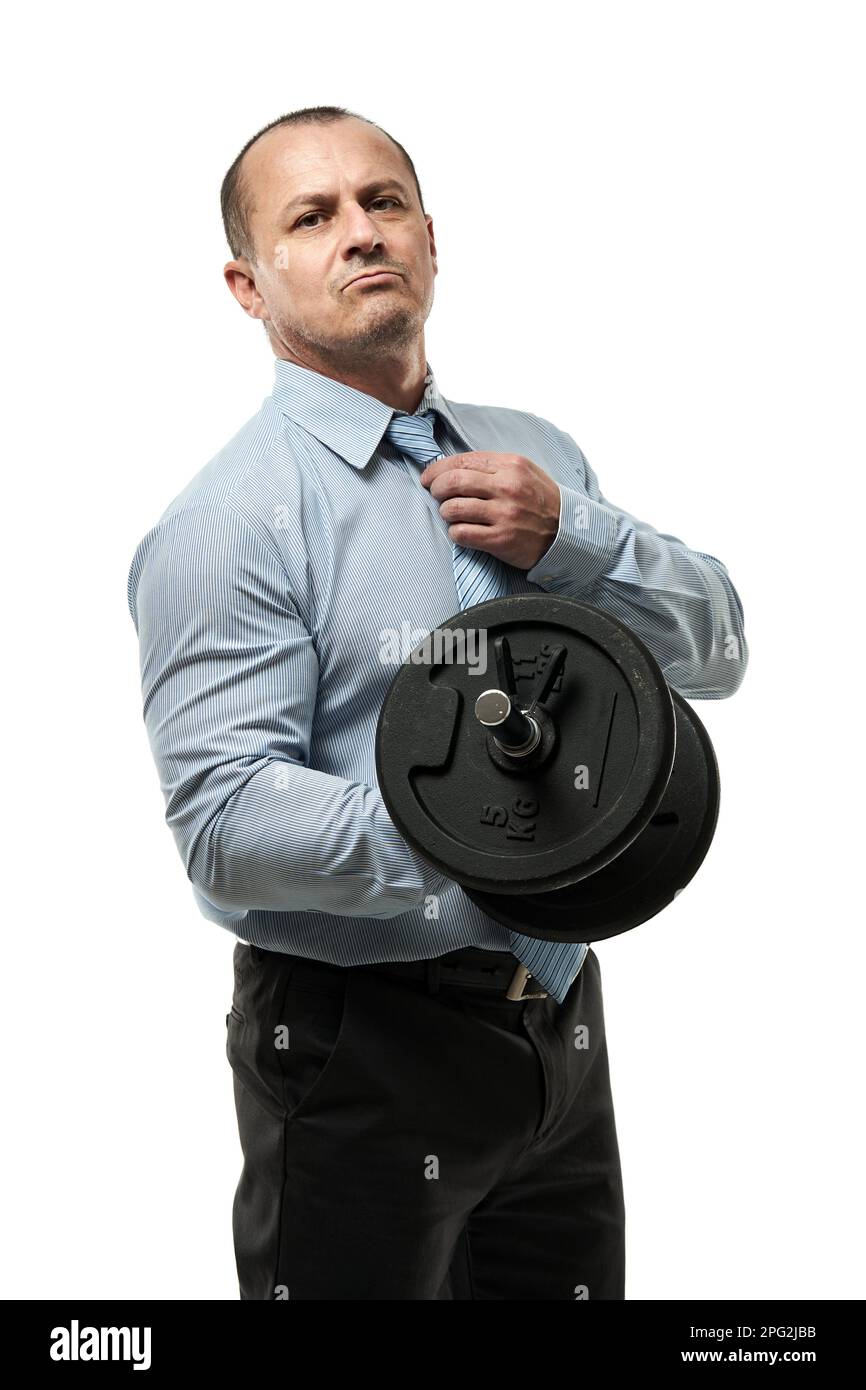 Strong businessman in business suit training with a dumbbell, showing ...