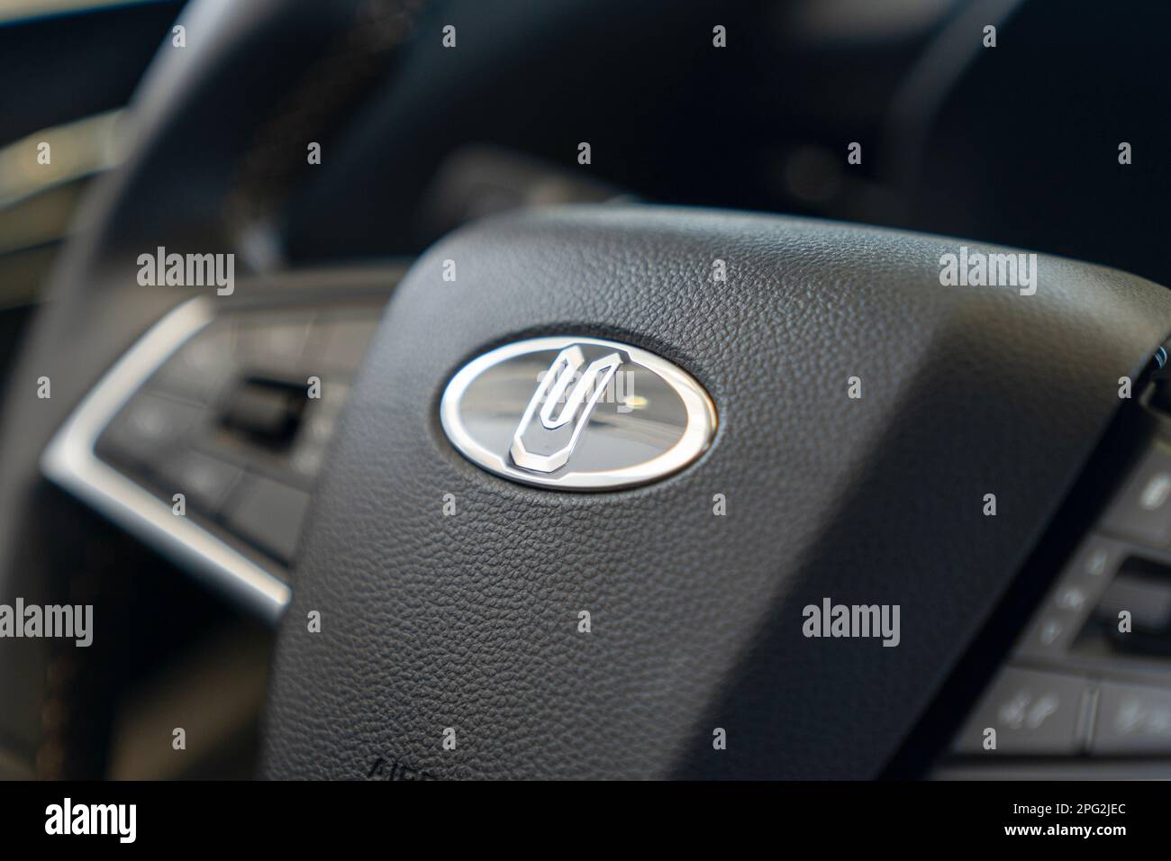 the Moskvich logo on the steering wheel of a new car, the revival of an ...