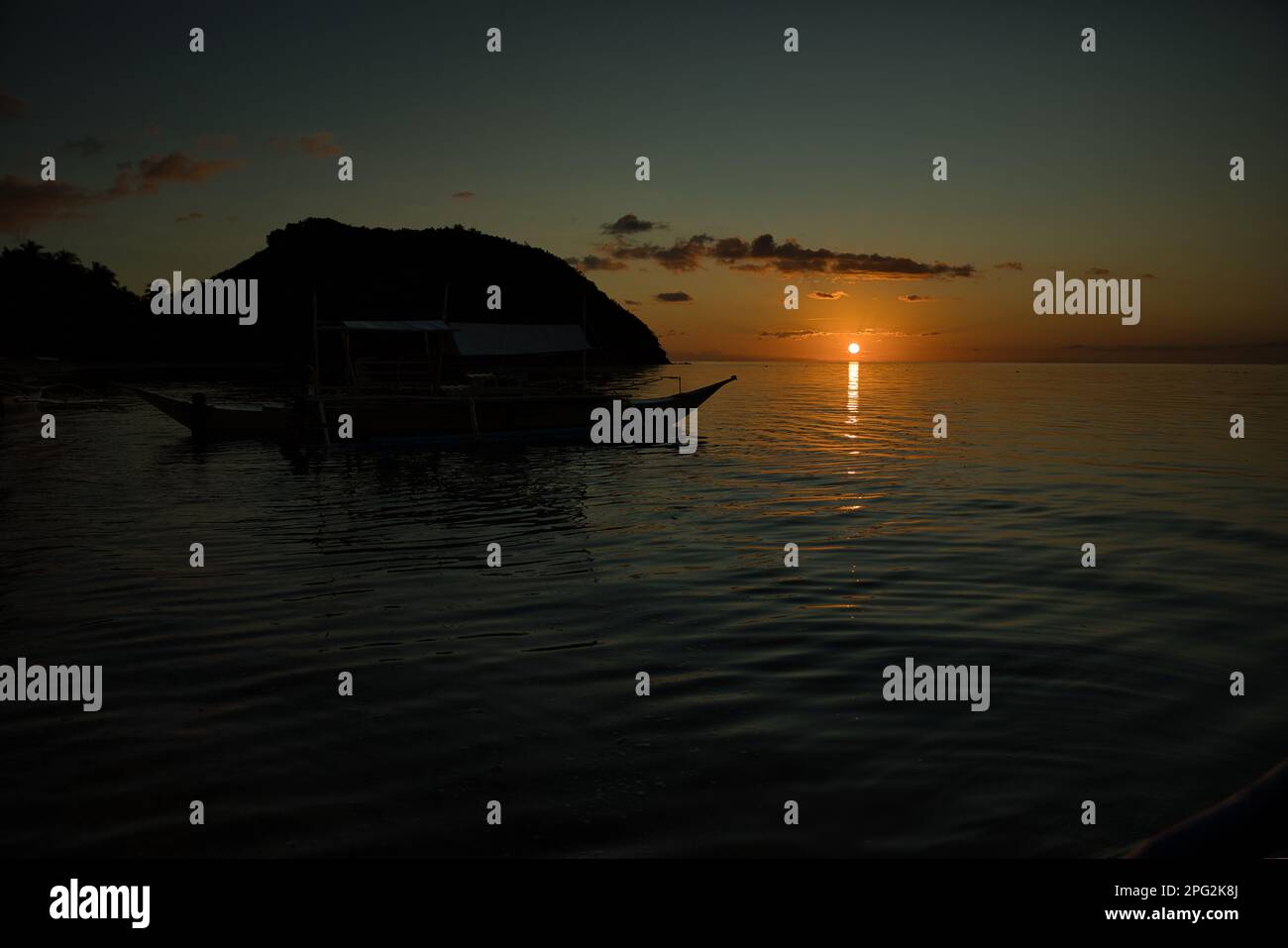 Picturesque golden yellow red sunset on the beach of Coron in the ...