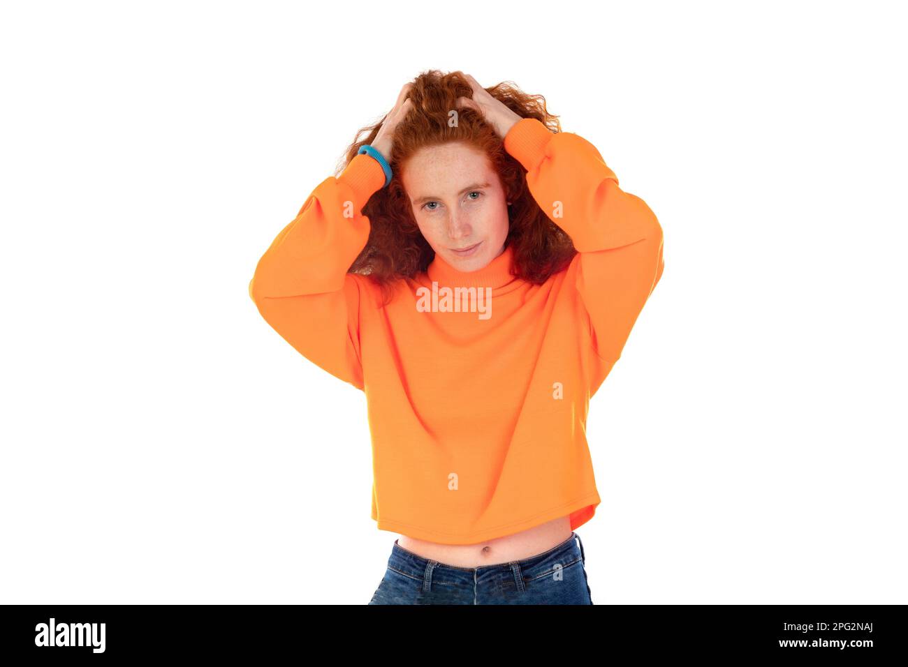 Beautiful fragile redheaded young woman in the dark. Sad frightened ...