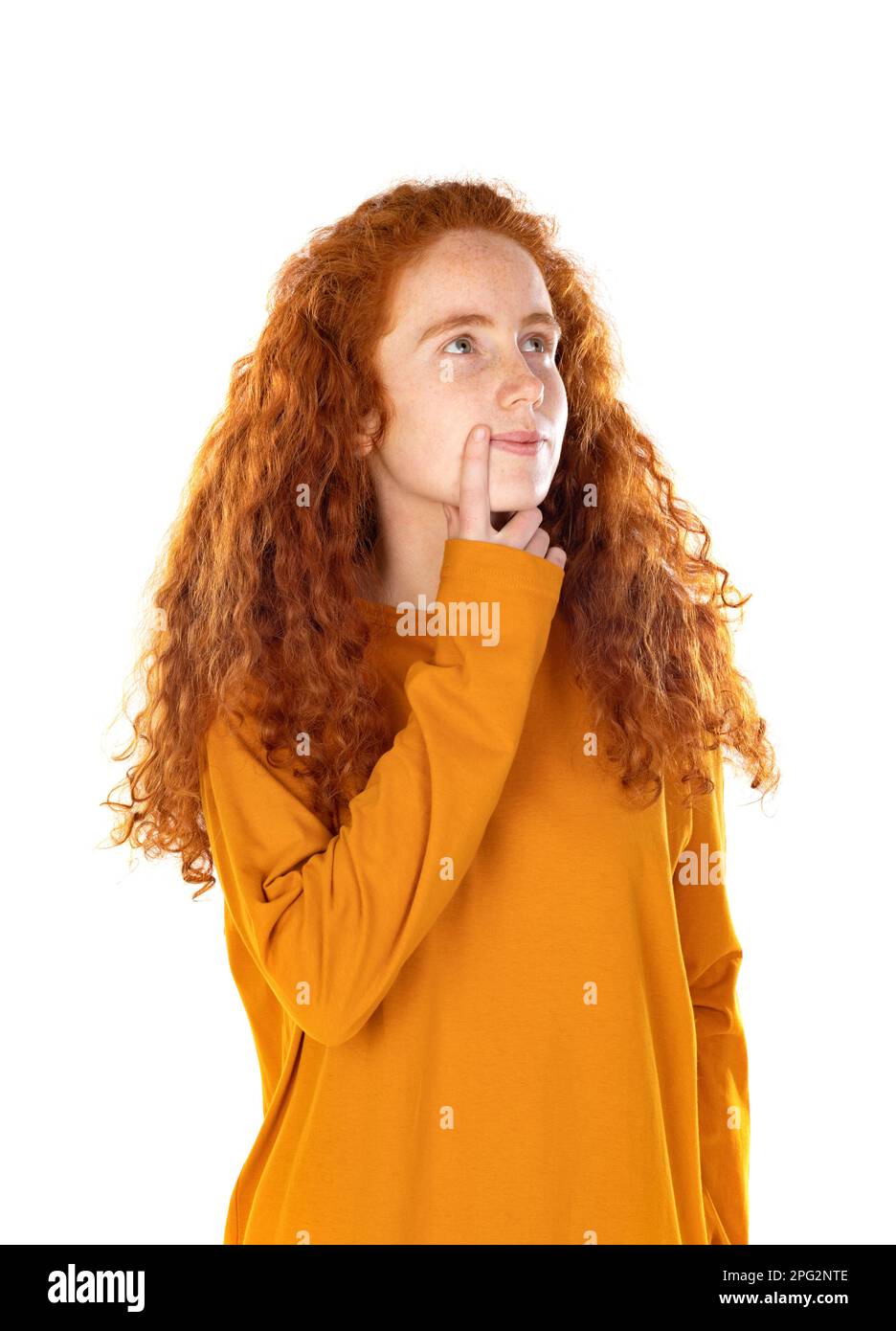 Pretty redhead young woman with long wavy hair and freckles wears t ...