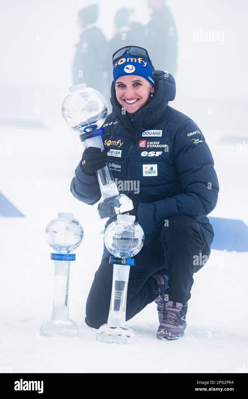 French biathlete Julia Simon receiving a big crystal globe for winning ...