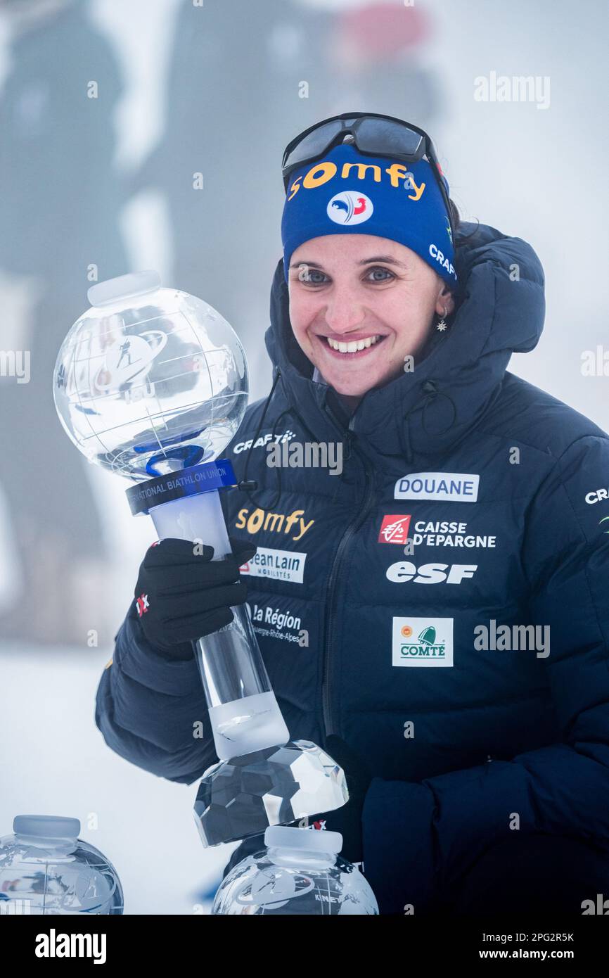 French biathlete Julia Simon receiving a big crystal globe for winning ...