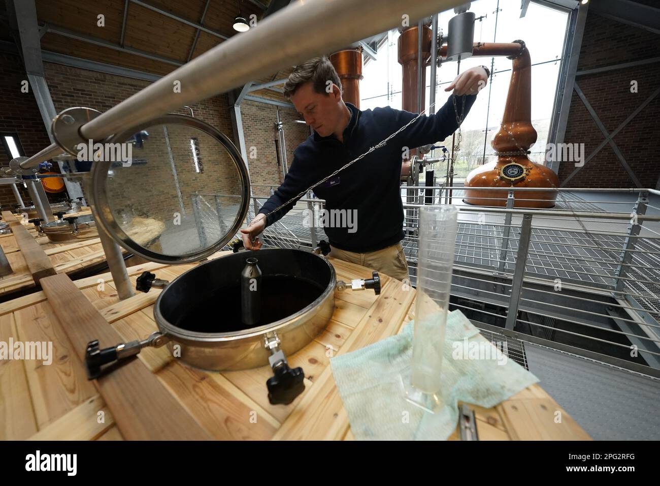 Ben Murphy, 37, director of distilling, checks the apparatus at the new ...