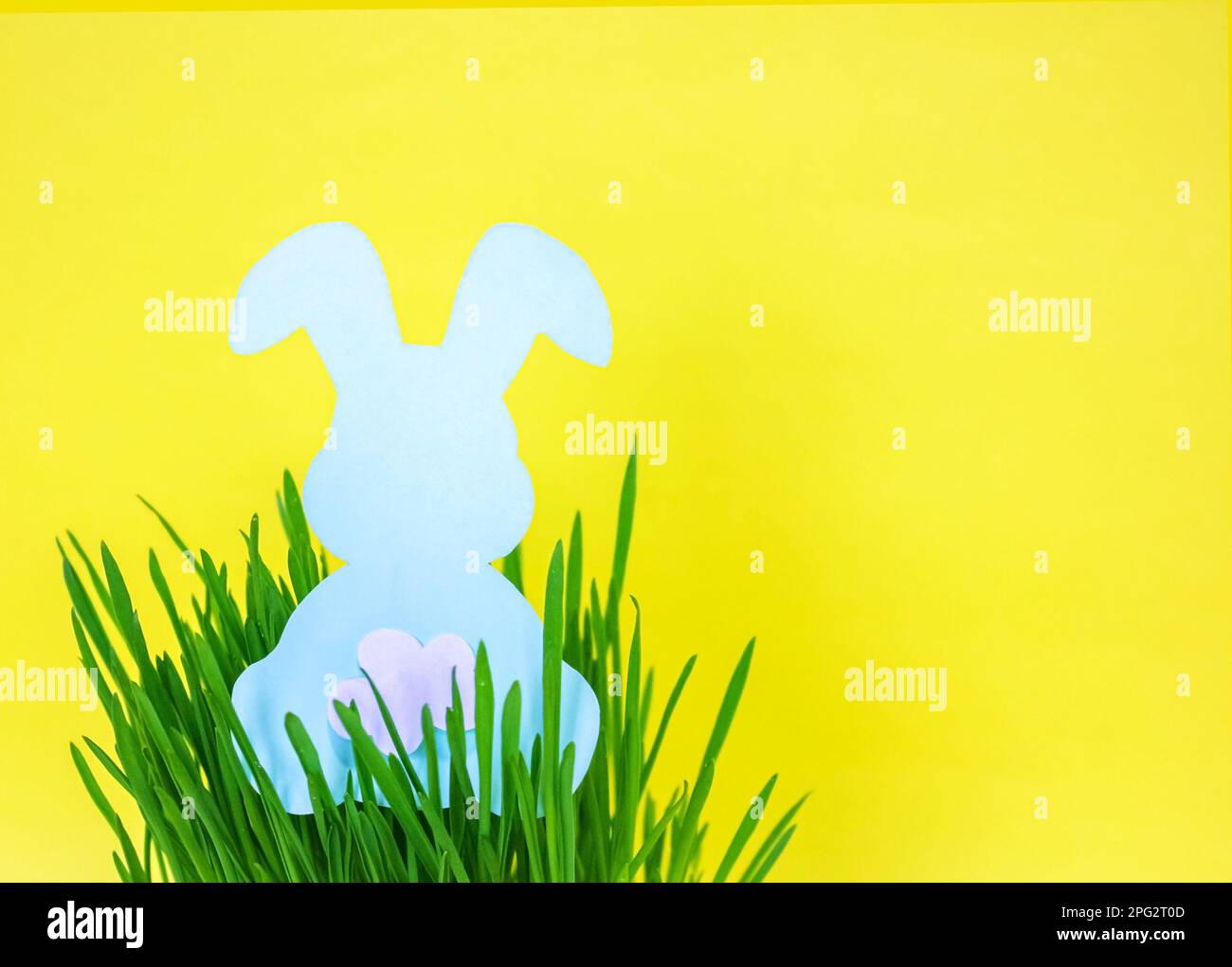 Easter Background with Silhouette bunny in grass on yellow background ...