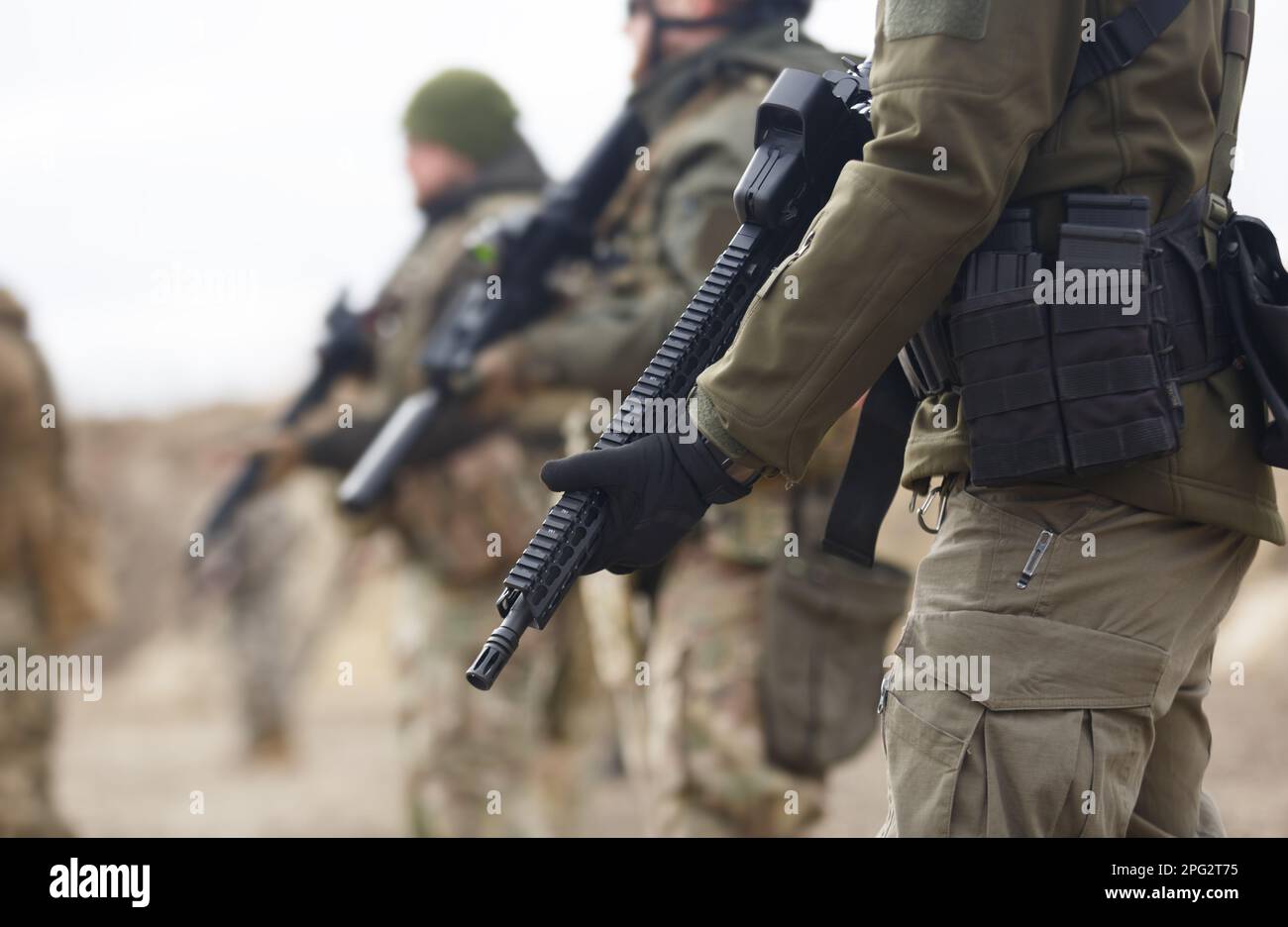 Group of Ukrainian soldiers equipped with modern assault rifles ...