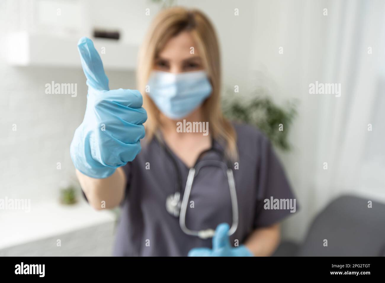female doctor's hands in nitrile blue gloves show finger Stock Photo ...