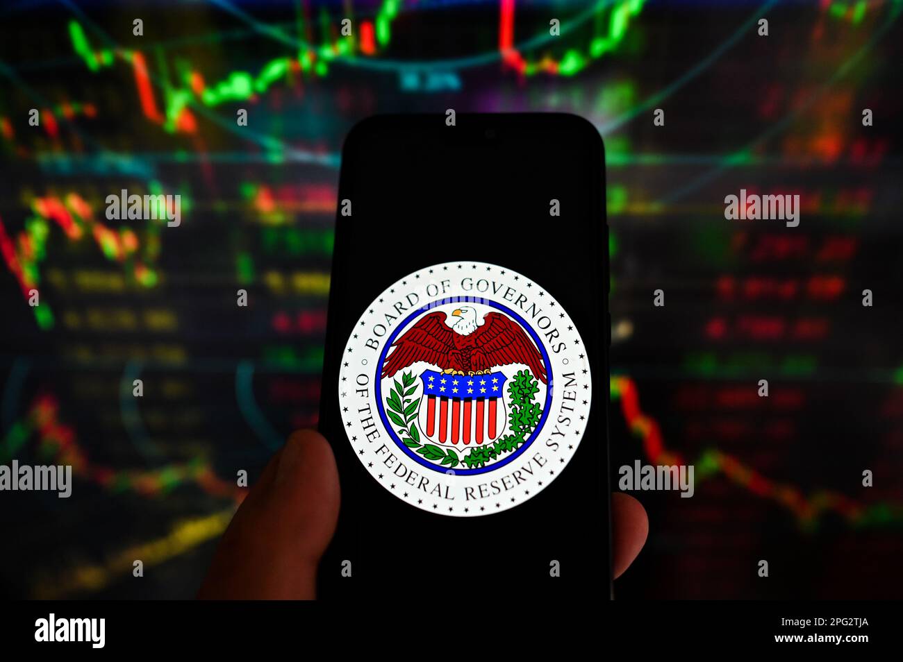 In this photo illustration, a US Federal Reserve logo is displayed on a ...