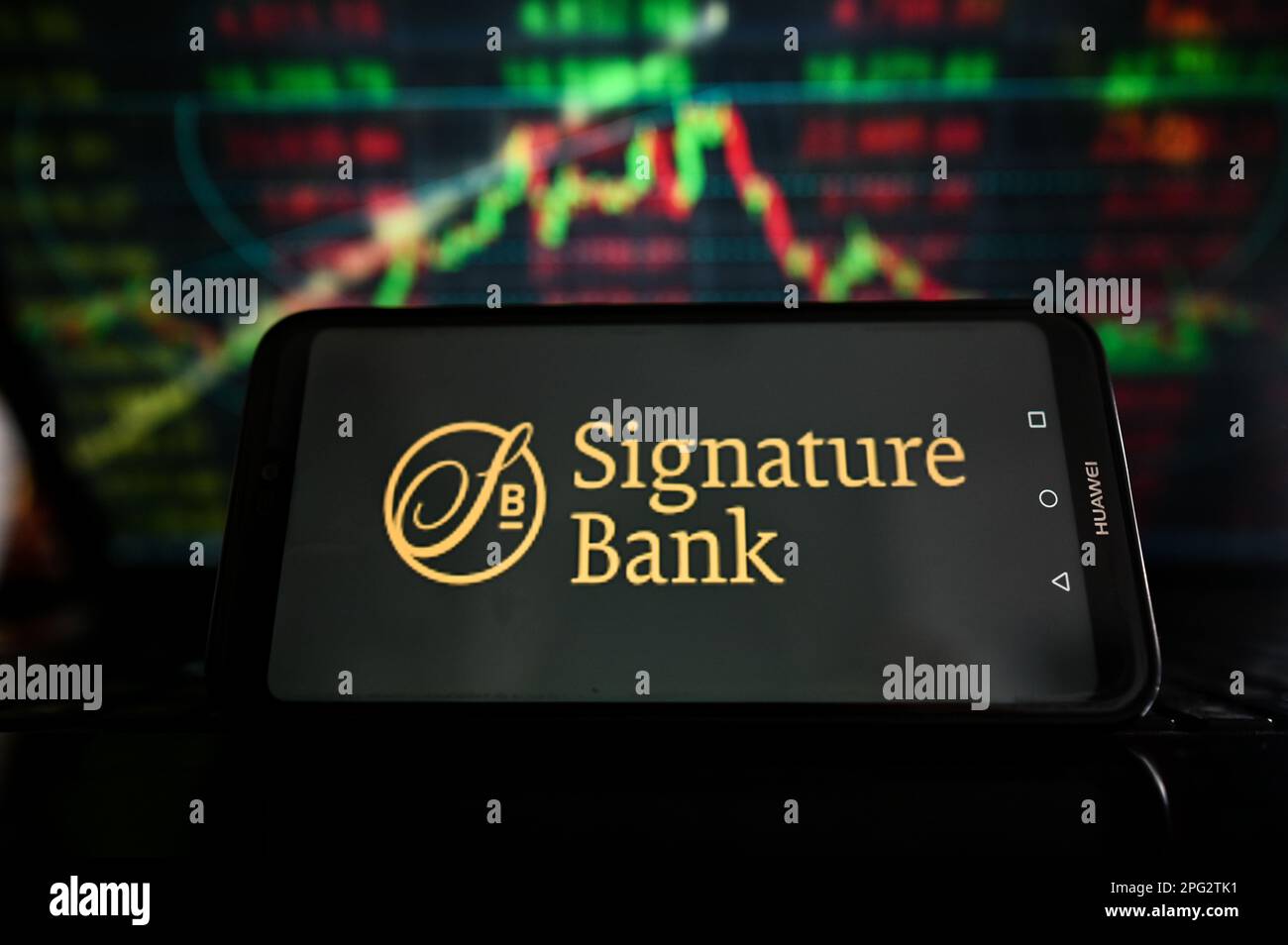 In this photo illustration, a Signature Bank logo is displayed on a ...