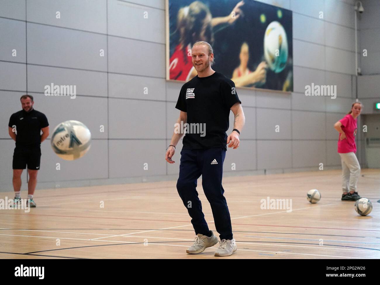 Paralympic gold medallist Jonnie Peacock kicking a ball in an inclusive ...