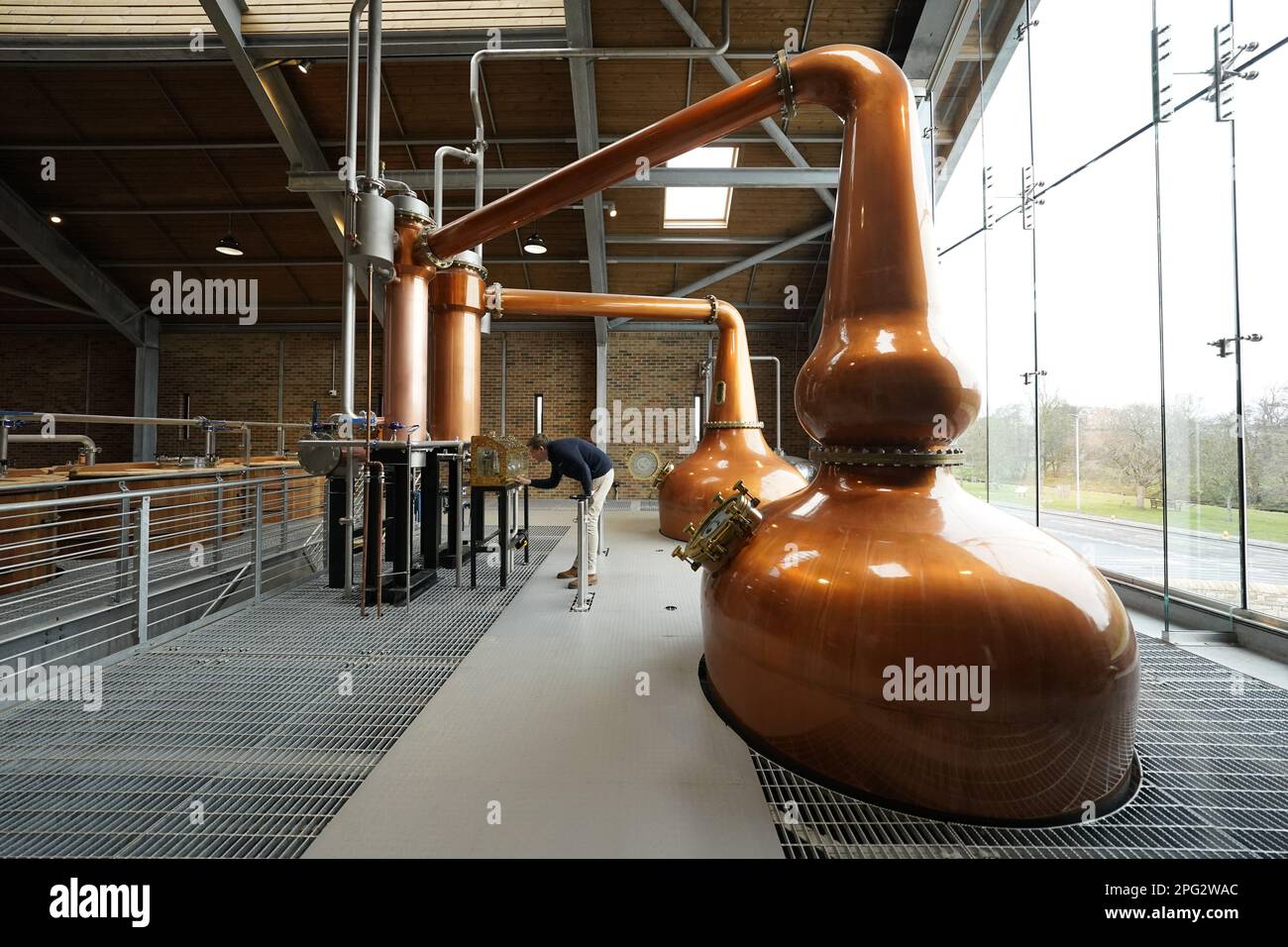 Ben Murphy, 37, director of distilling, checks the apparatus at the new ...