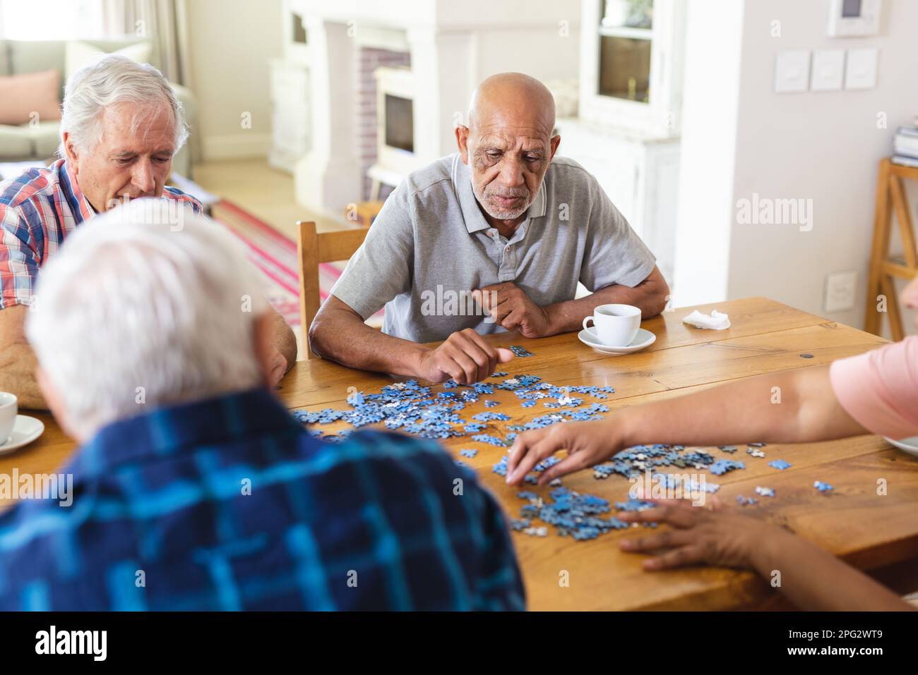 Women sitting together table hi-res stock photography and images - Alamy