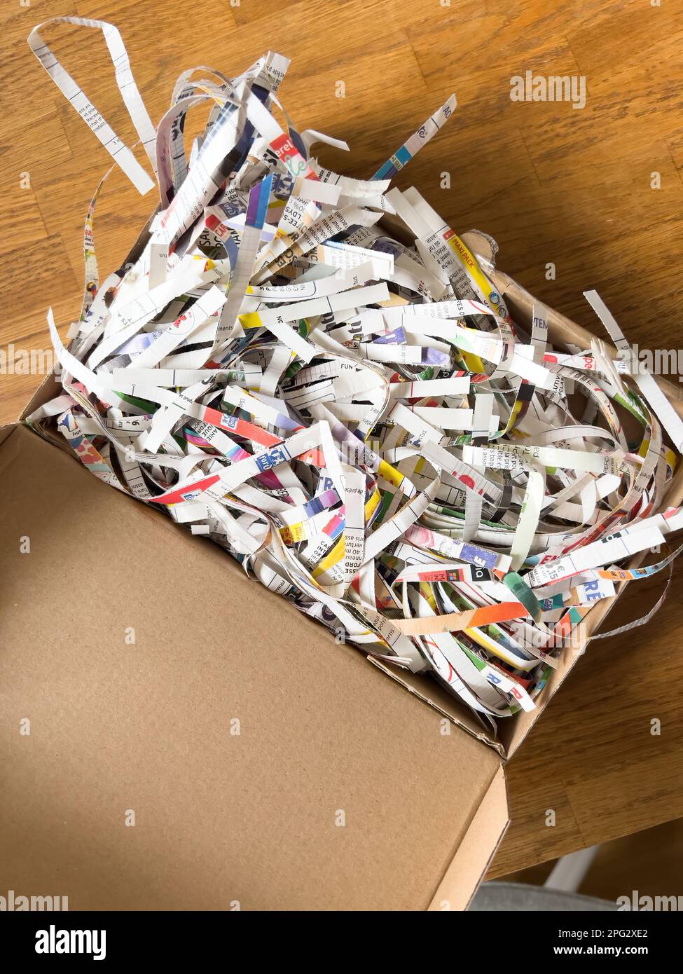 A close-up of a chaotic heap of shredded newspaper, cardboard and other ...