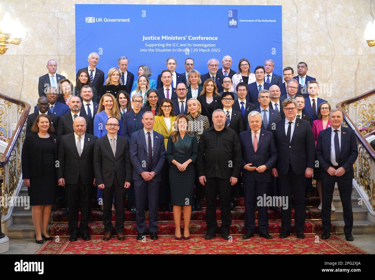 Attendees pose for a photo at the Justice Ministers' conference at ...