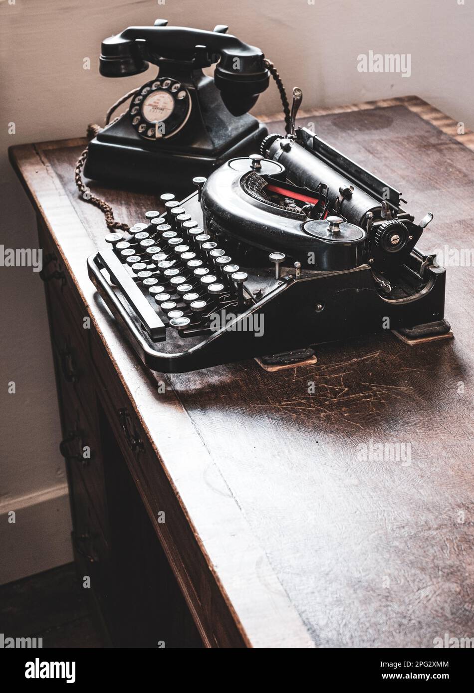 Old portable typewriter and baker phone on a desk in the foremans ...