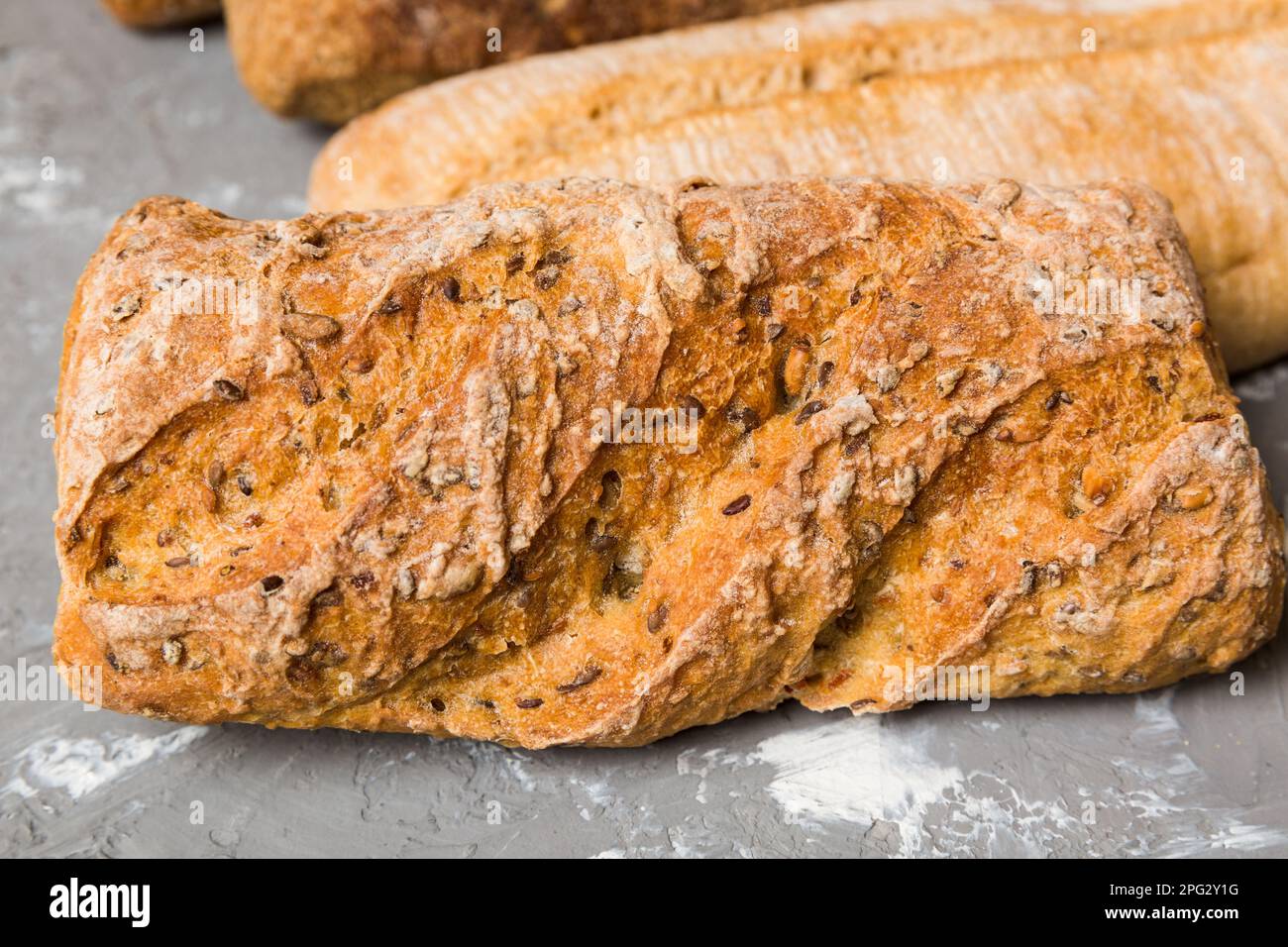 Homemade natural breads. Different kinds of fresh bread as background ...