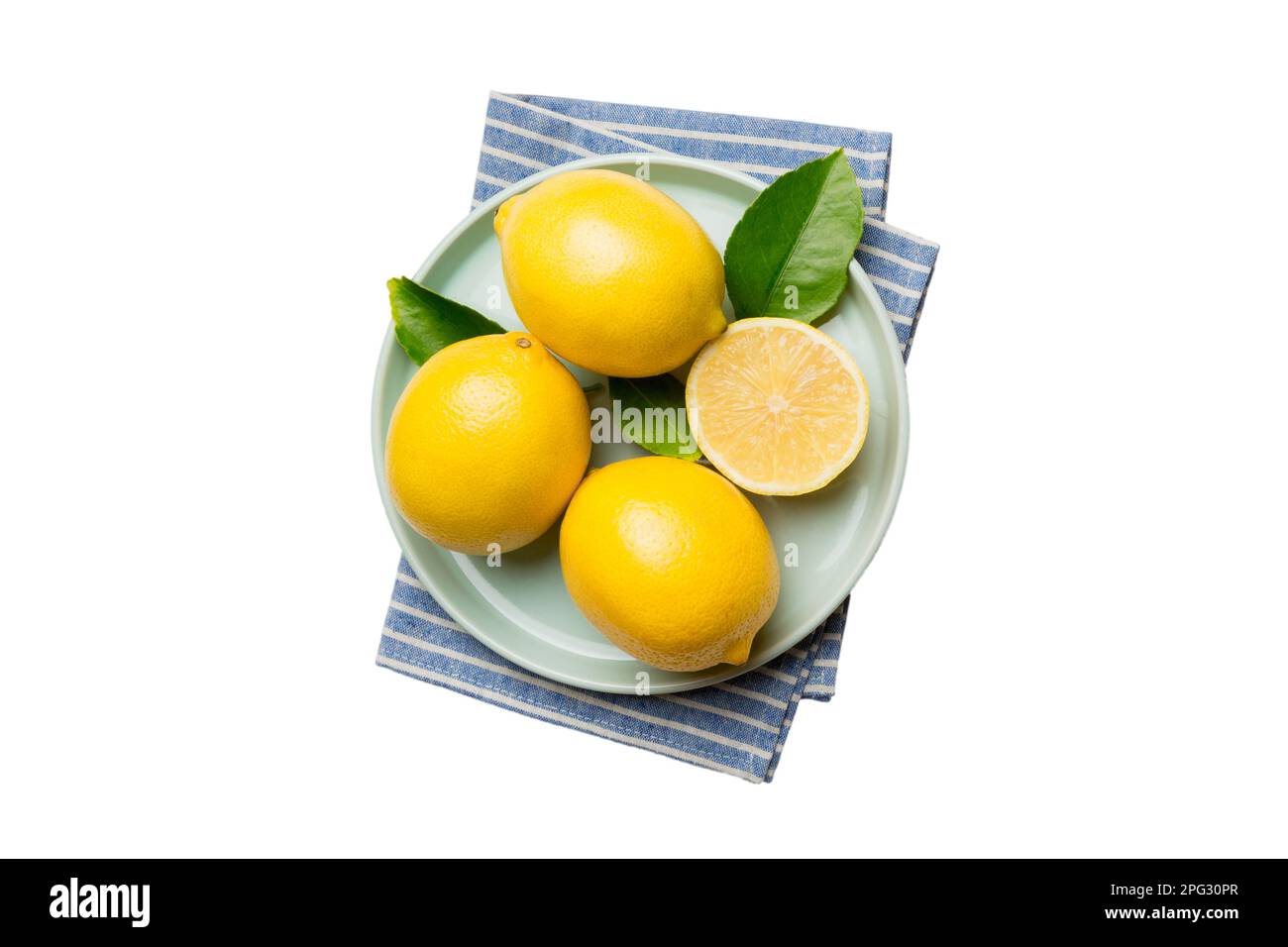Fresh cutted lemon and whole lemons over round plate isolated on white ...