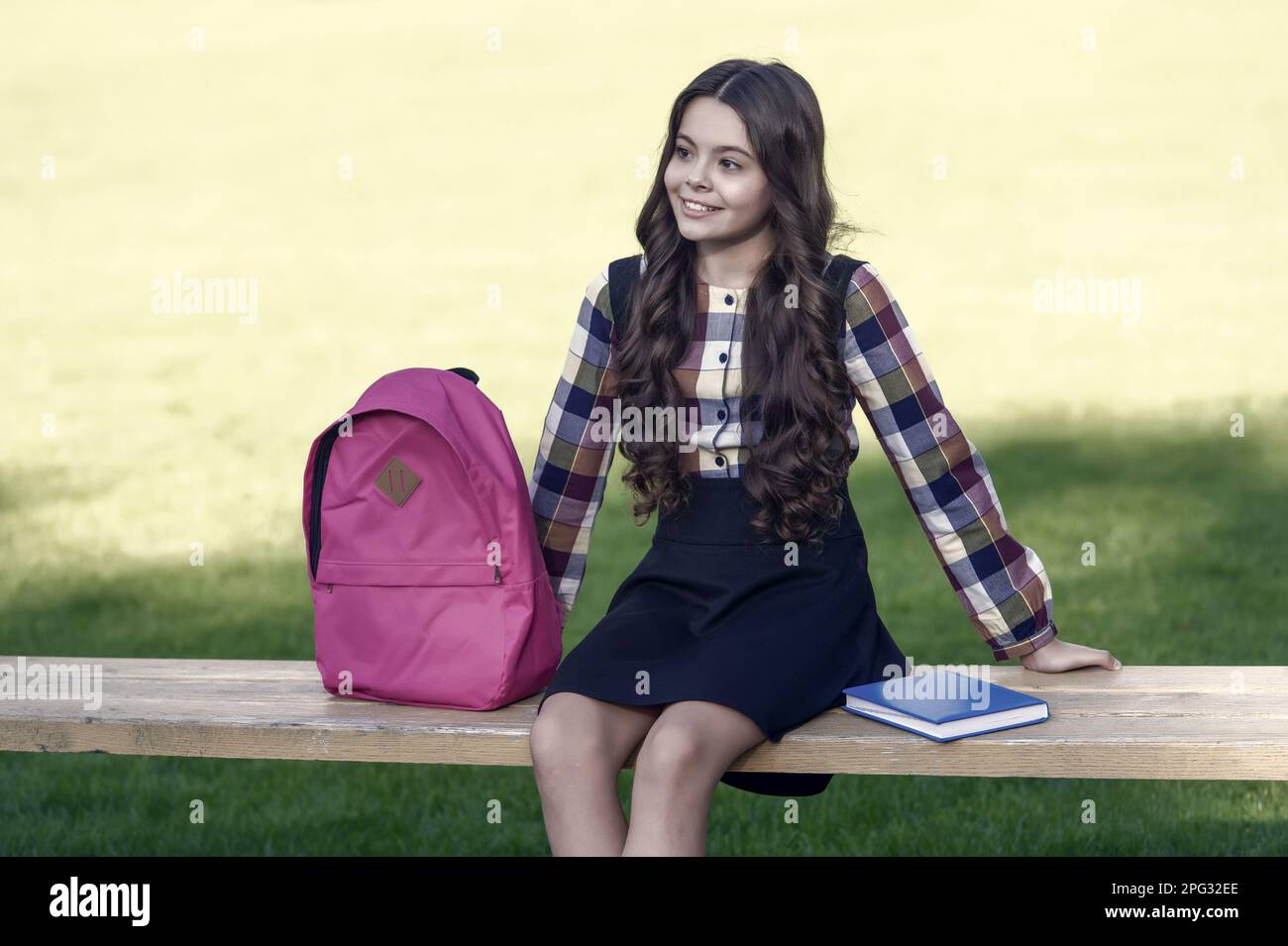 Learning never ends. Happy child relax on bench after classes. Homework assignment. Afterschool ...