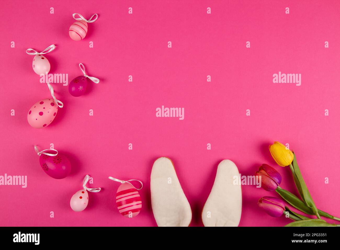 Pink Easter background with copy space, Easter eggs, tulips and bunny ...