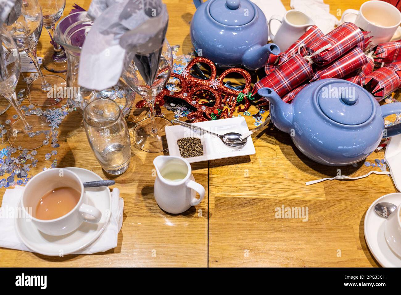 Used dishes and glasses on a table after a Christmas meal in a ...