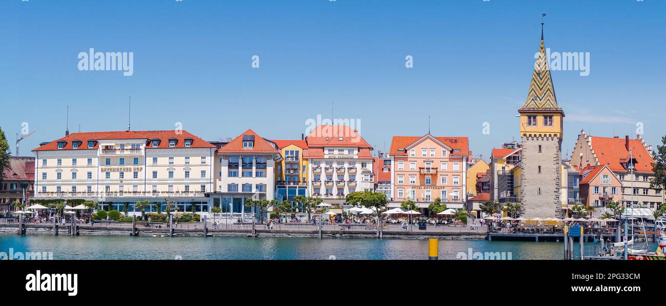 Panorama of Lindau harbor on Lake Constance (Bodensee). Old lighthouse ...
