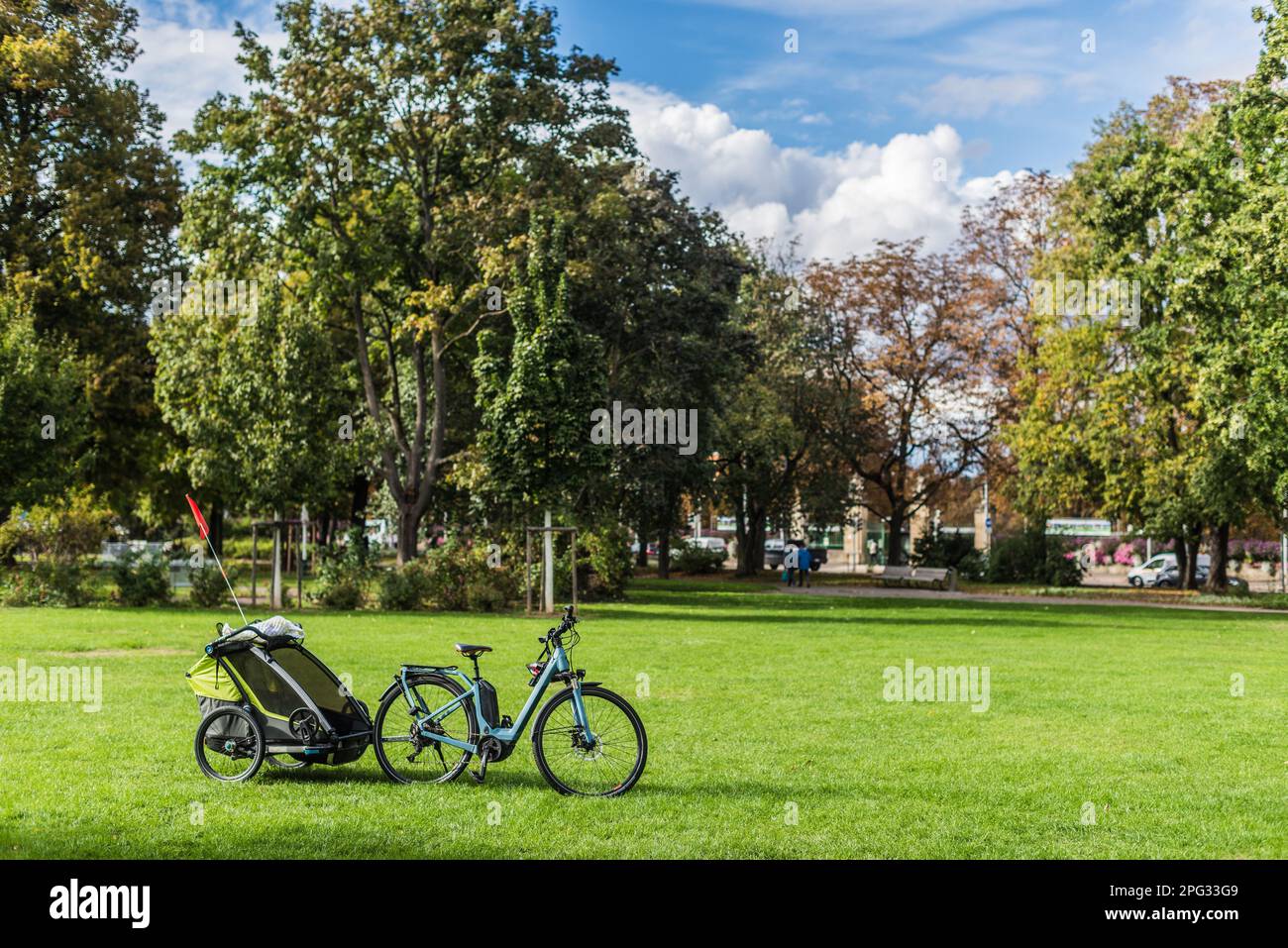 Bicycle with children bike trailer on flowers background. Family ...