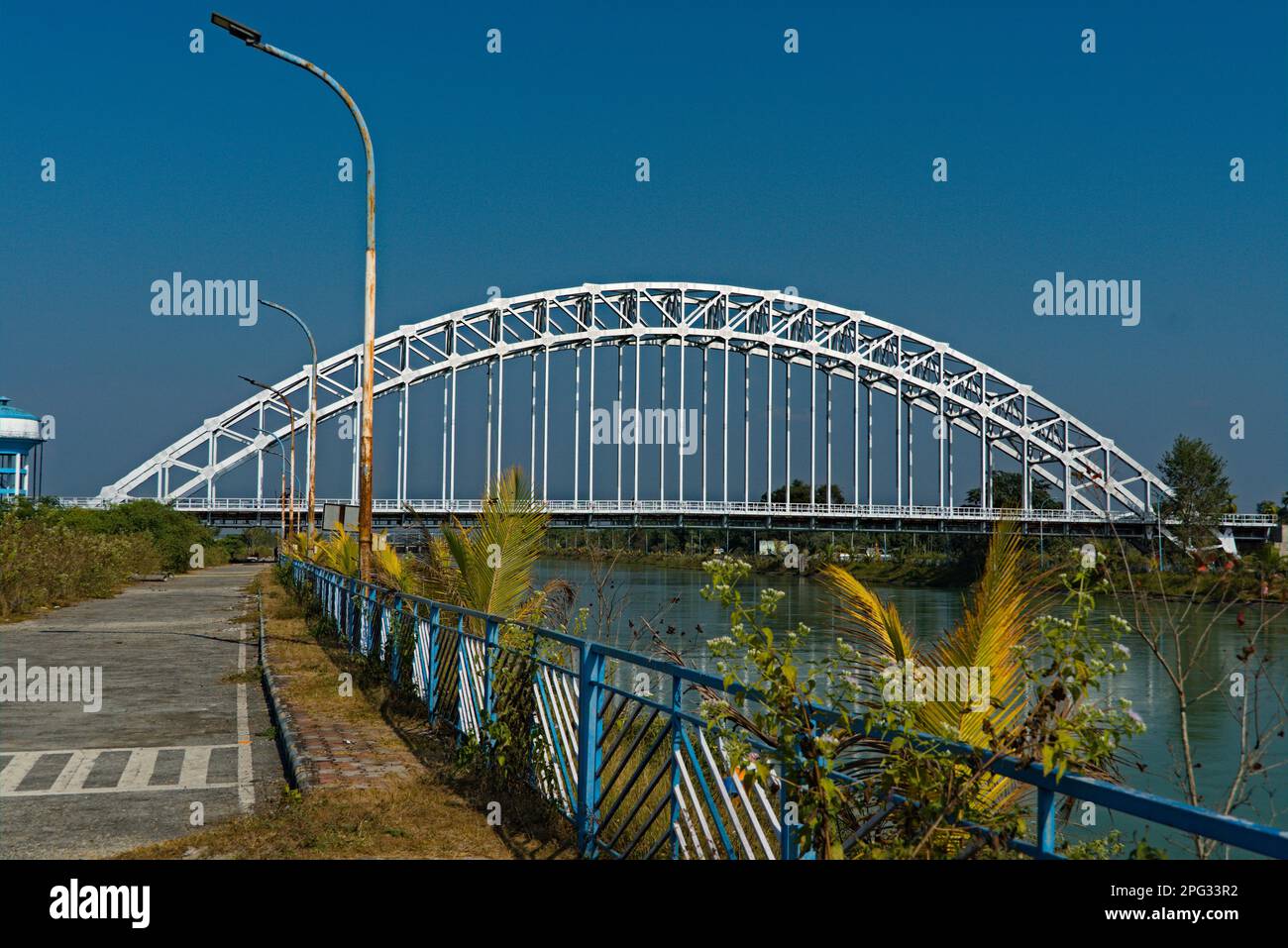 arch shaped road bridge over the river canal Stock Photo - Alamy