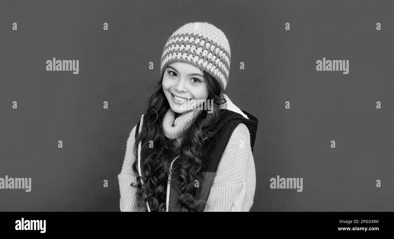 express positive emotion. winter fashion. positive kid with curly hair ...